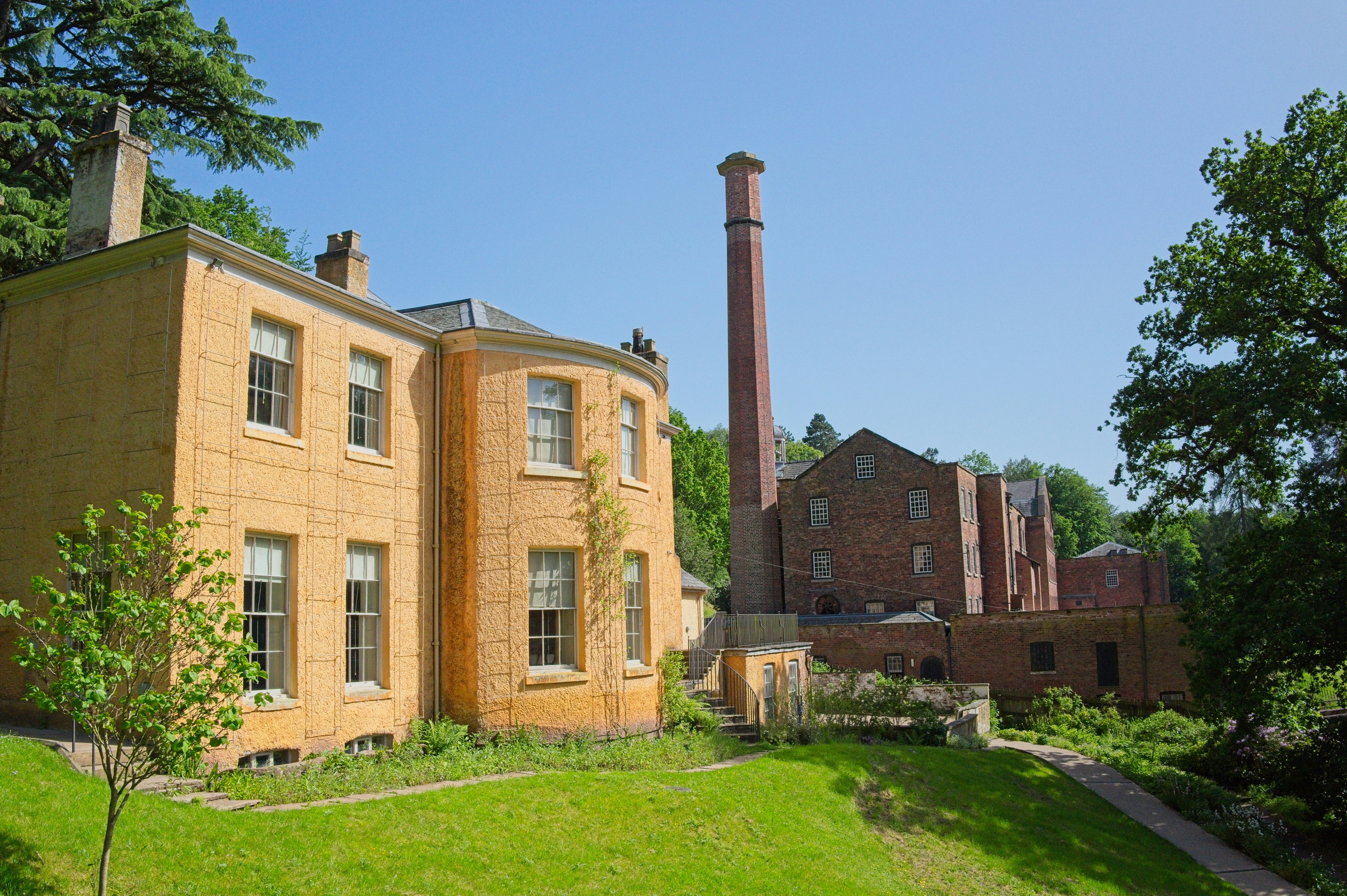 Sunlit Heritage: Brick Chimneys and Golden Facades in a Quiet Estate