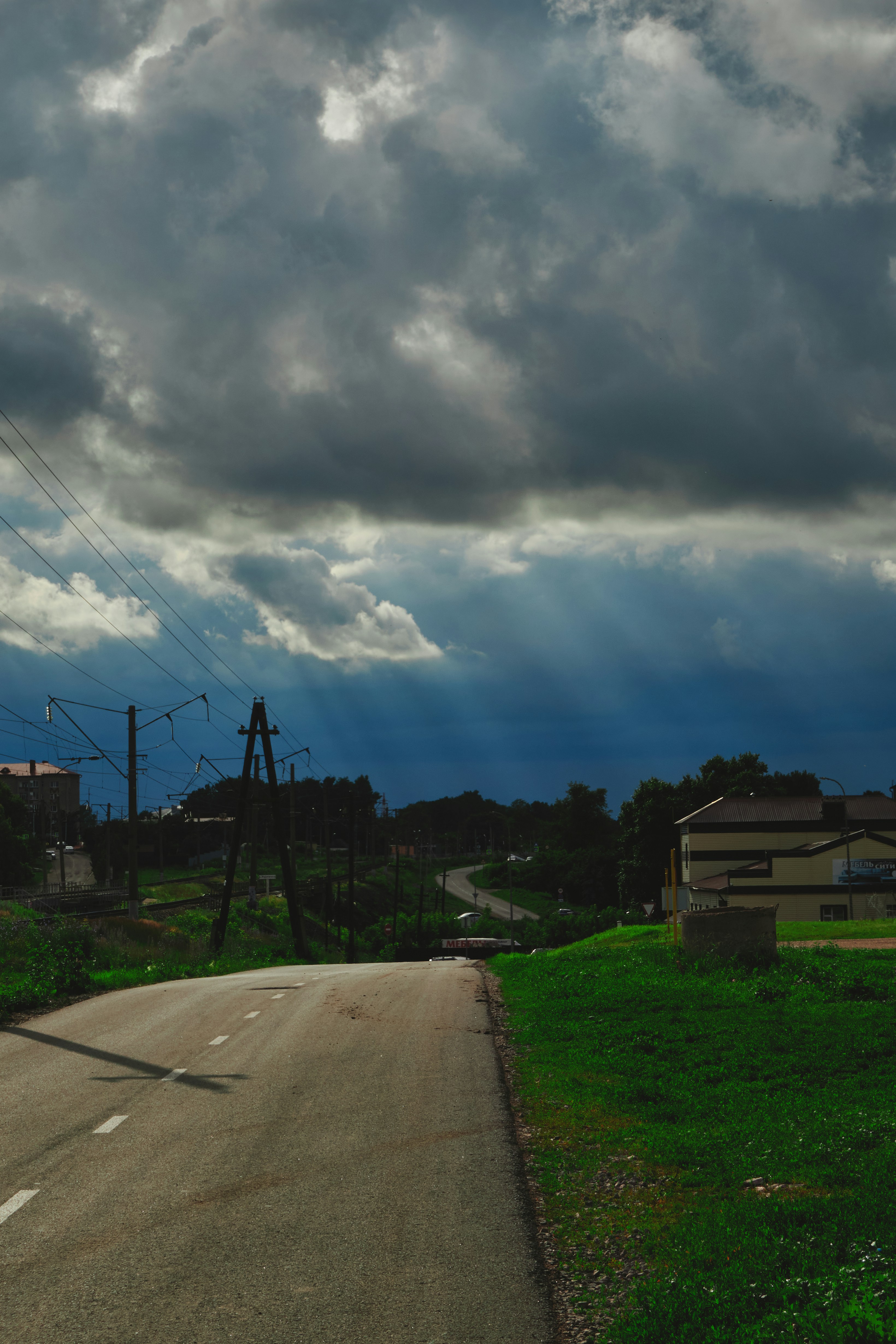 Rural Road Toward a Storm-Burnished Horizon