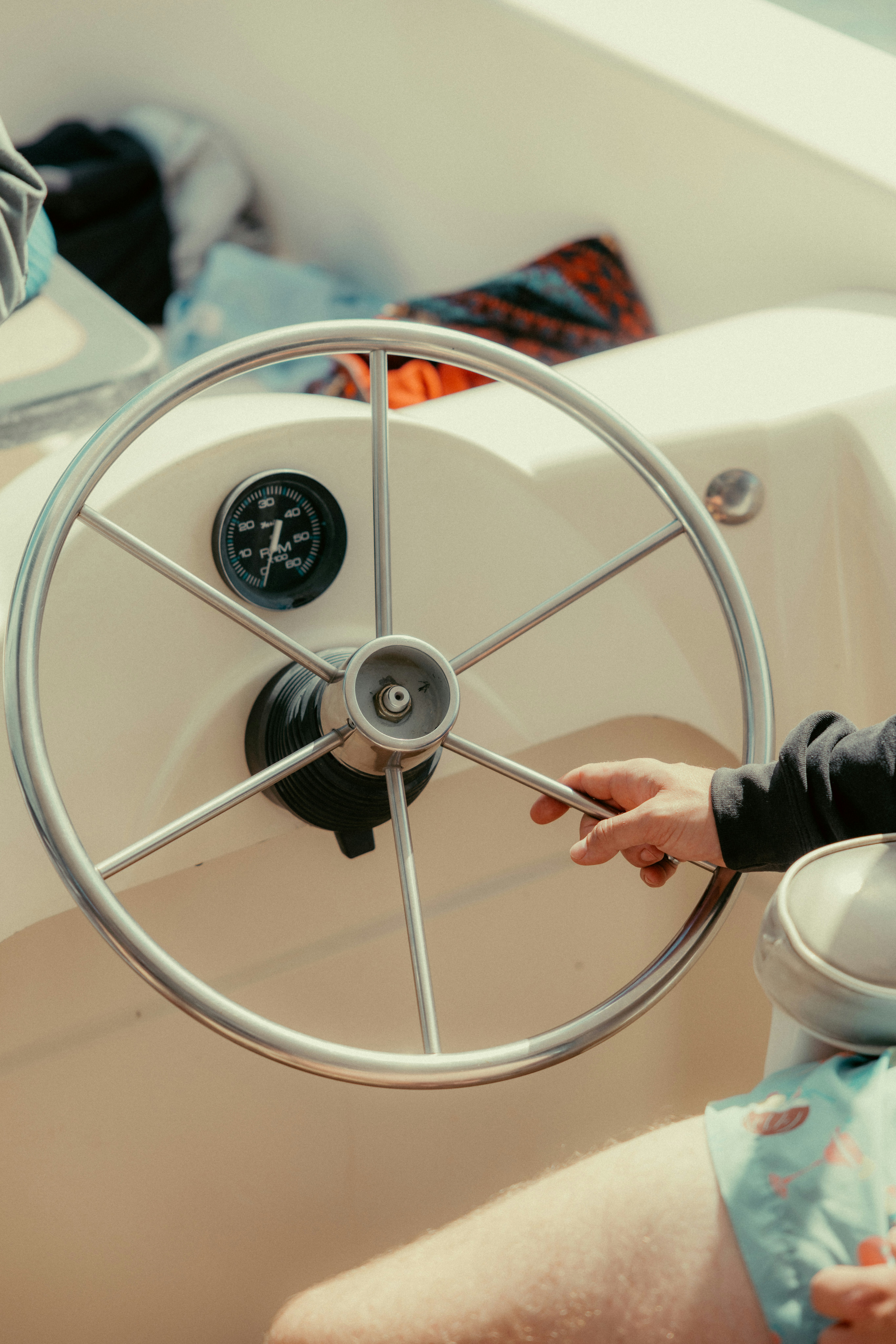 Steering Wheel in Focus: A Quiet Moment on the Boat