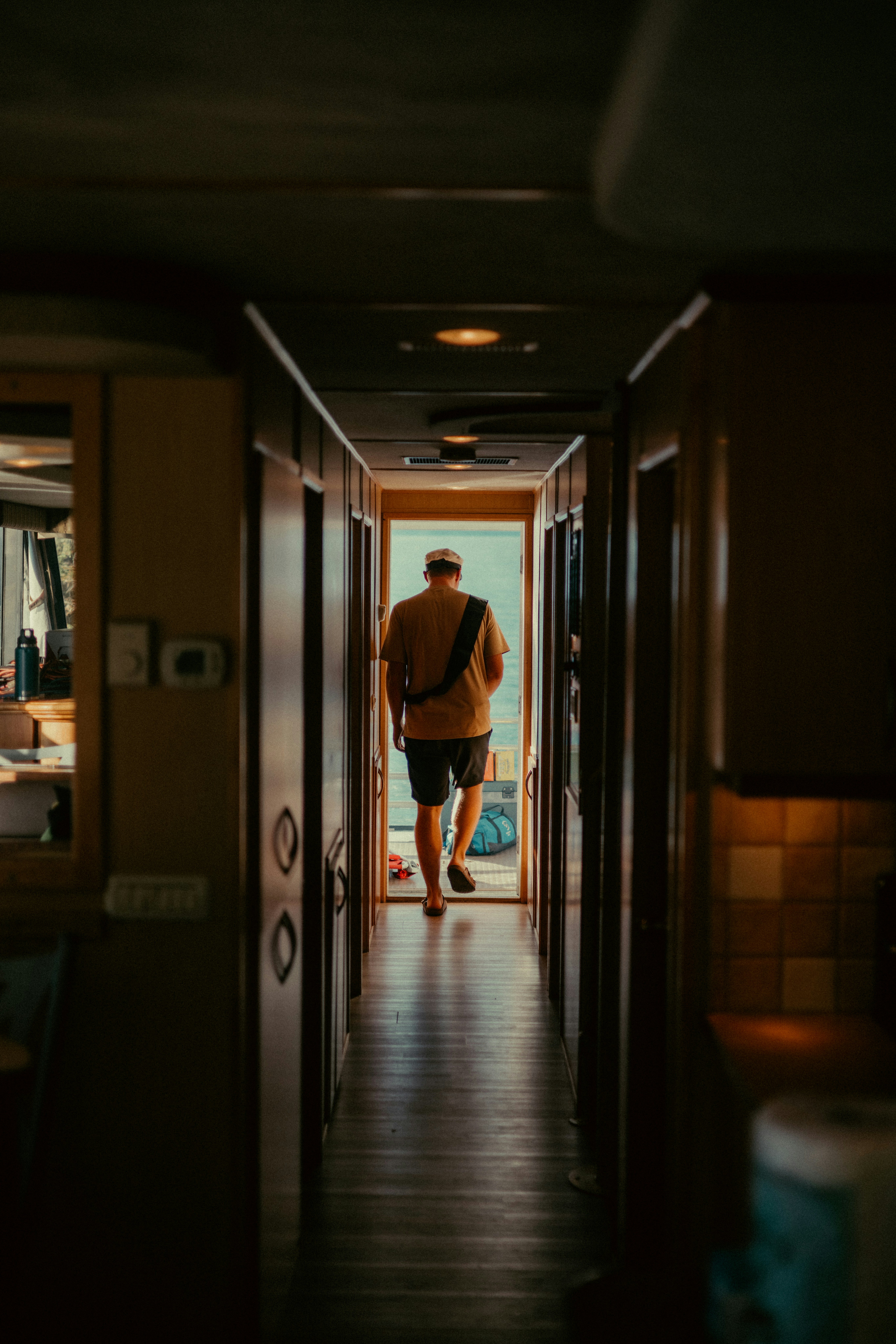 Traveler in a Narrow Corridor Toward Light