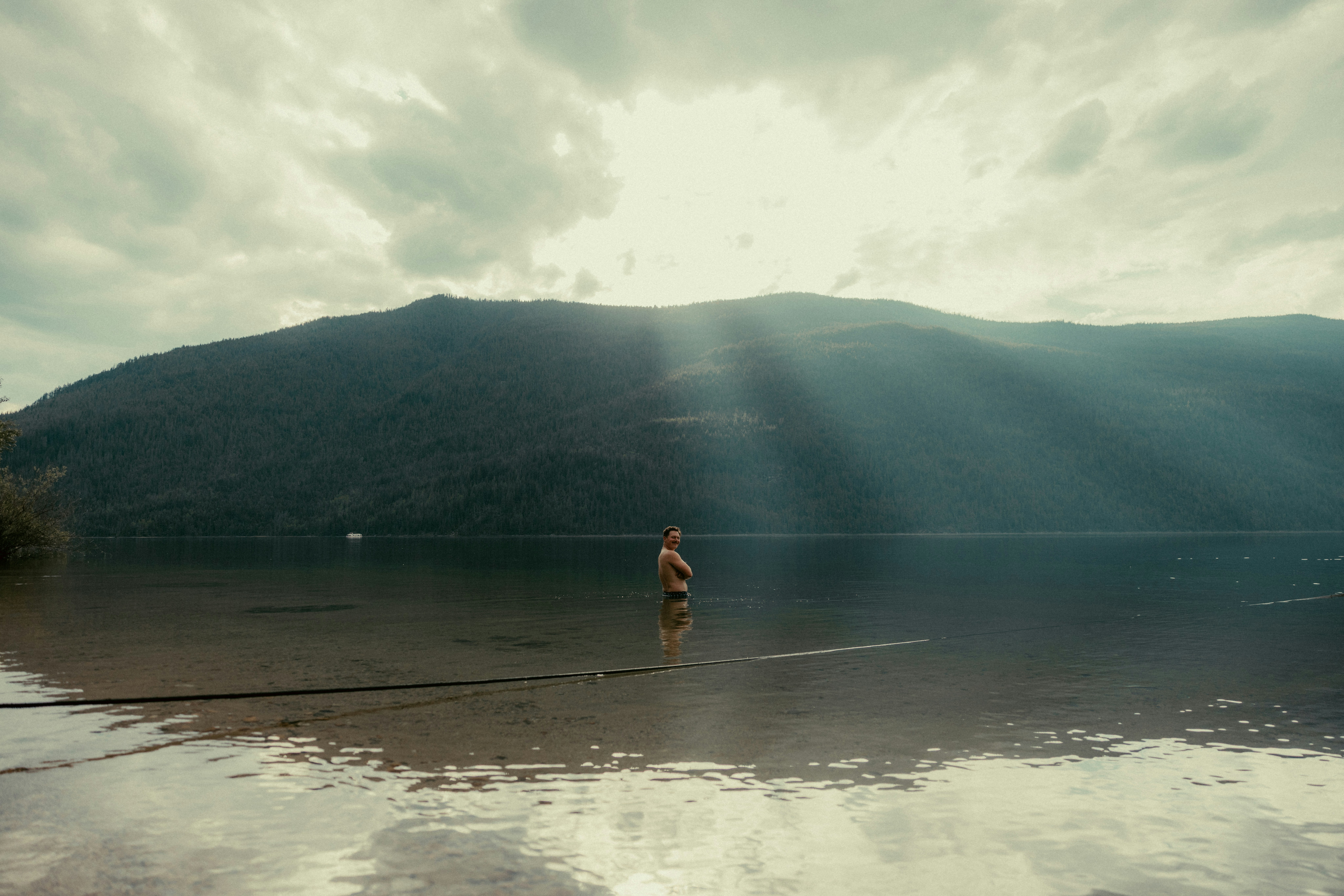 Solitary Diver in a Misty Alpine Lake