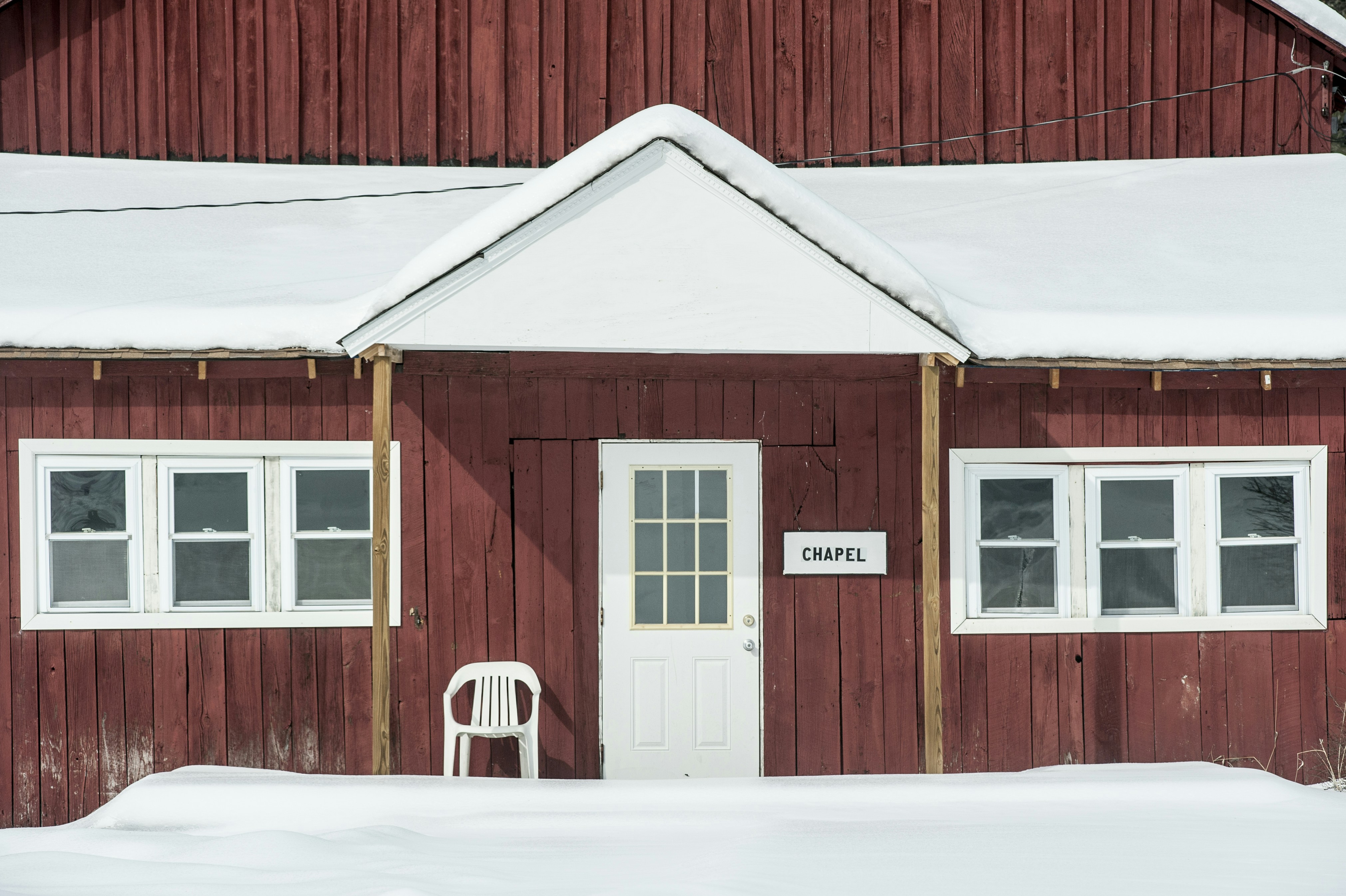 Chapel Door on a Snowy Barn