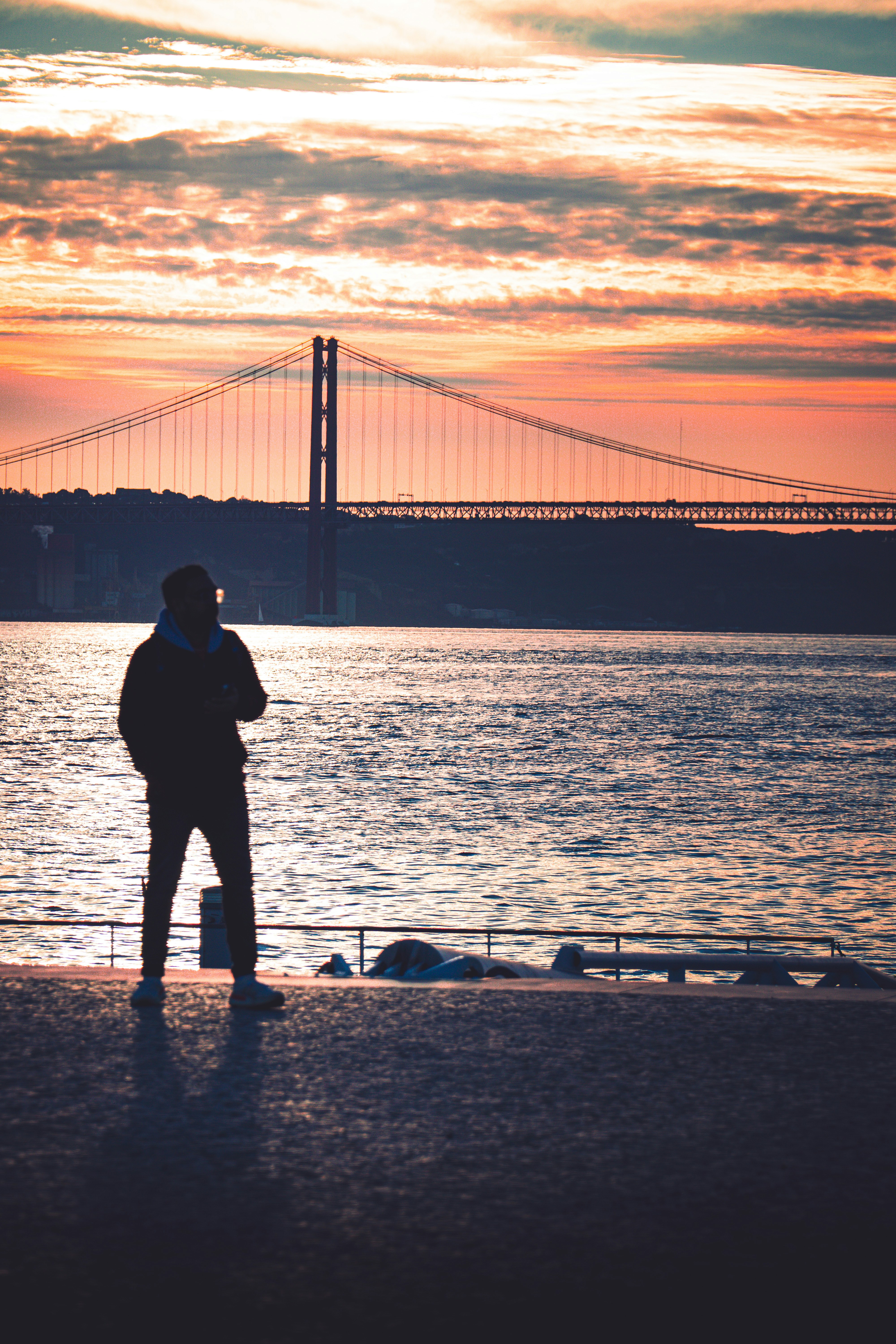 Silhouette by the Waterfront at Dusk