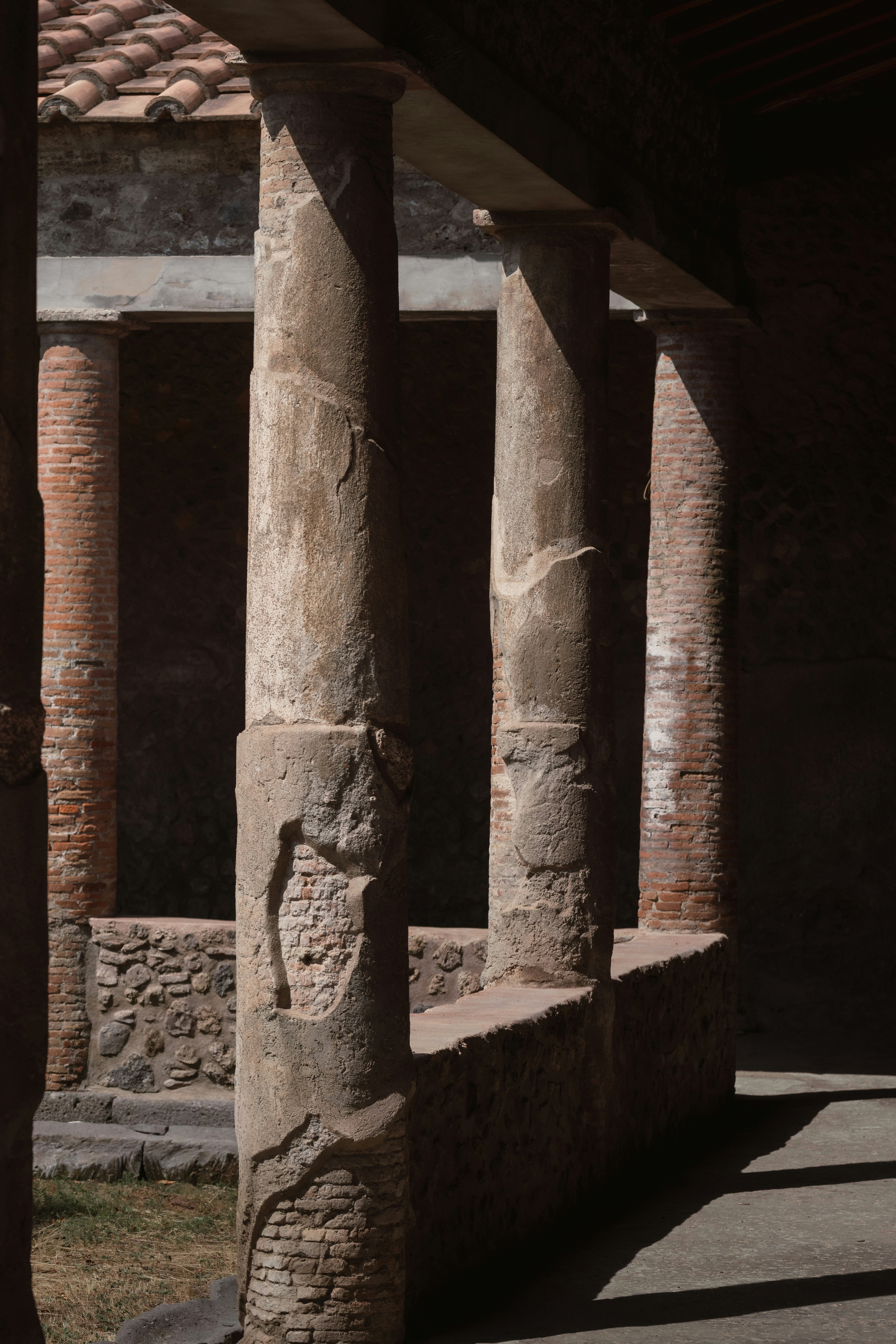 Stone Courtyard Columns Cast in Evening Light