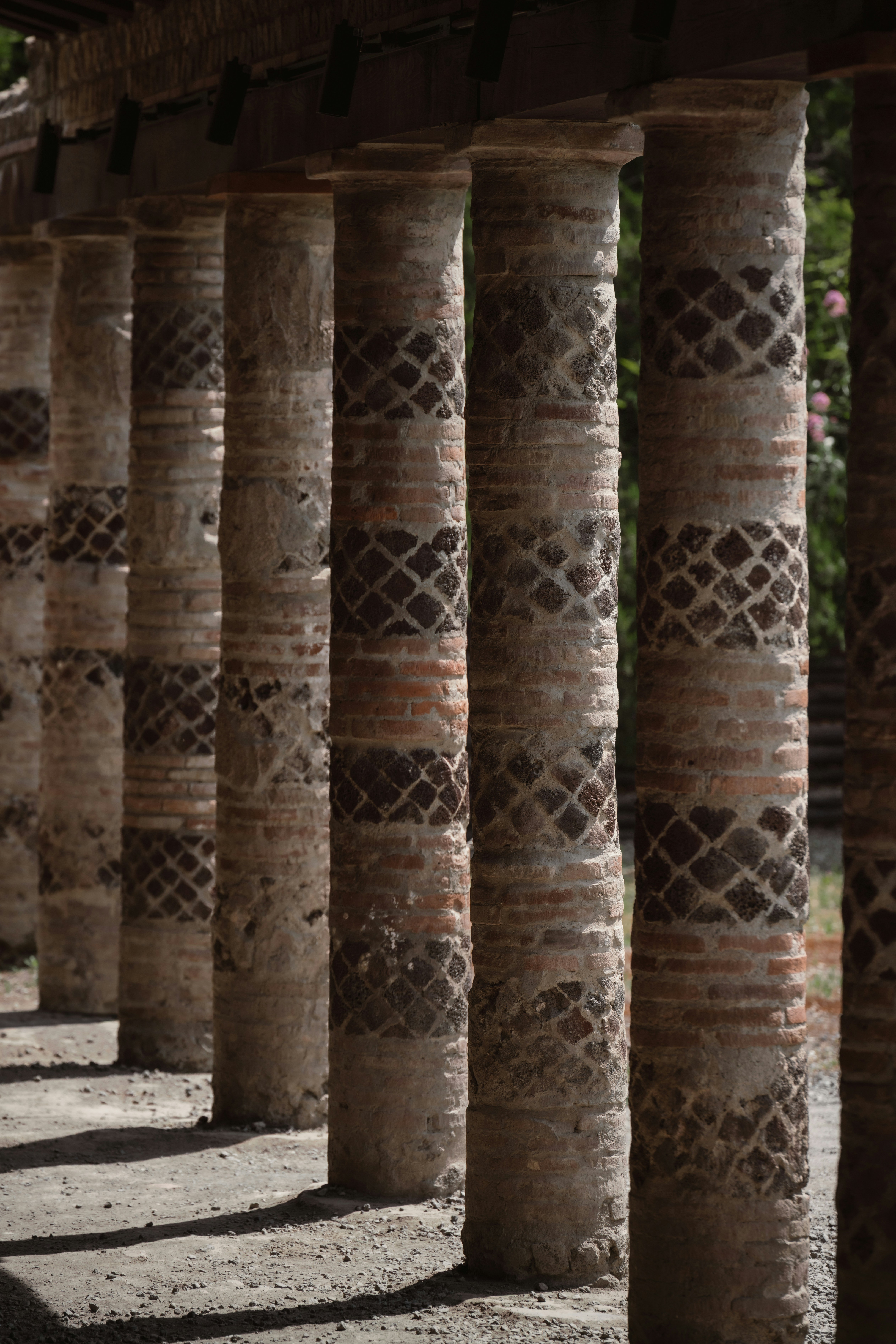 Echoes of Stone: Repeating Columns Under Dappled Light