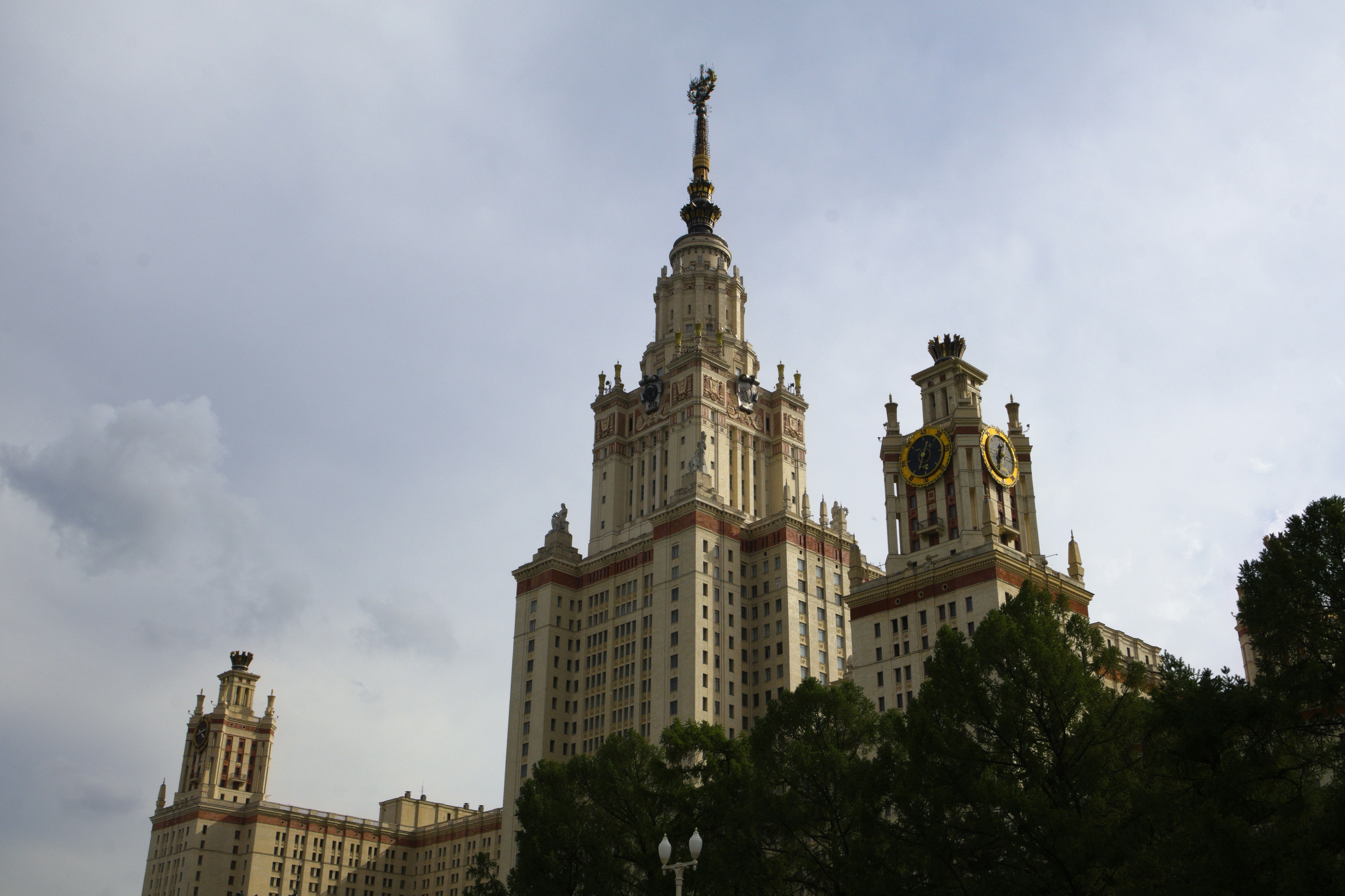 Towering Soviet-era Skyline: The City Hall Spires Reaching Toward a Cloudy Sky