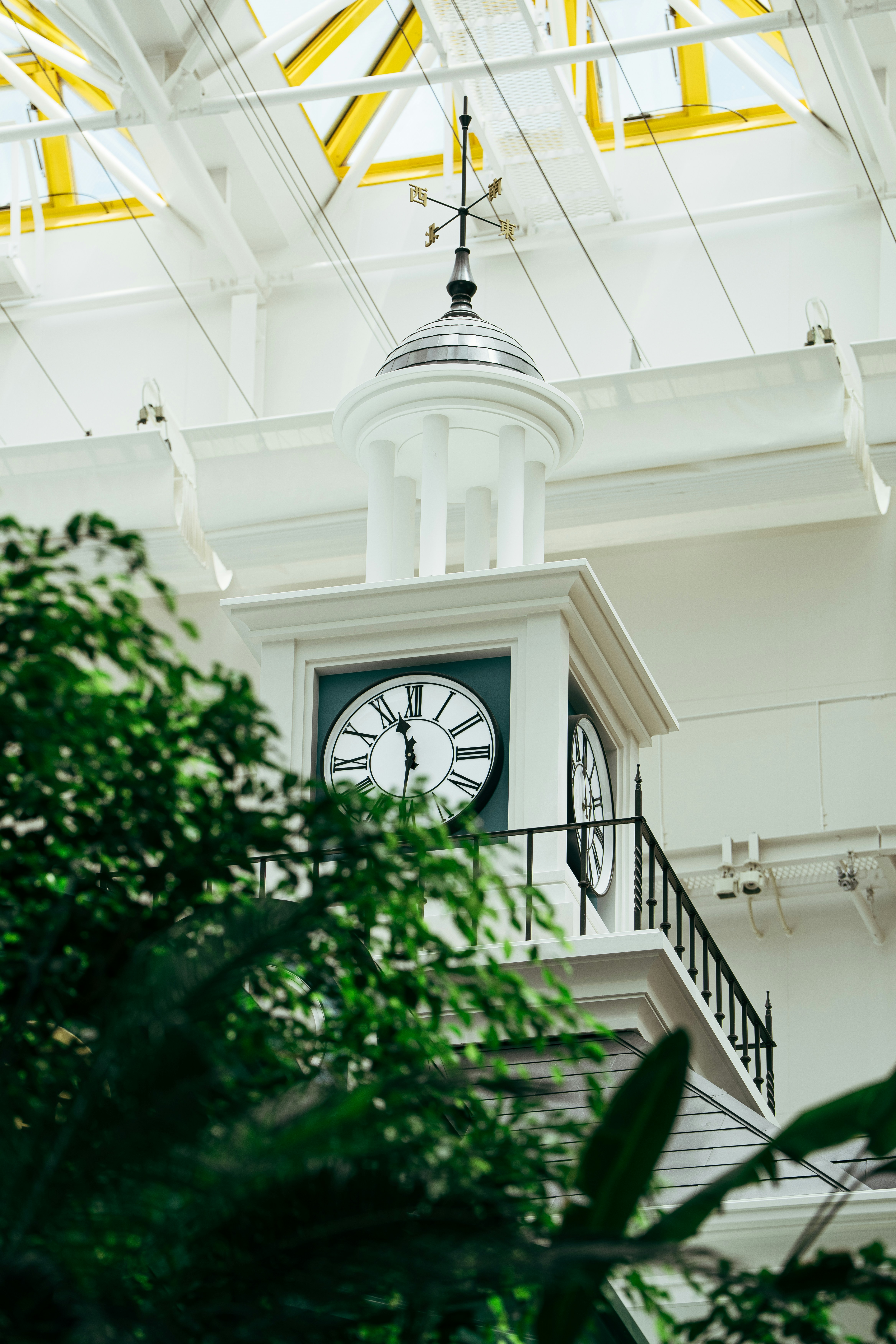 Timeless Clocktower Amid Glass and Greenery