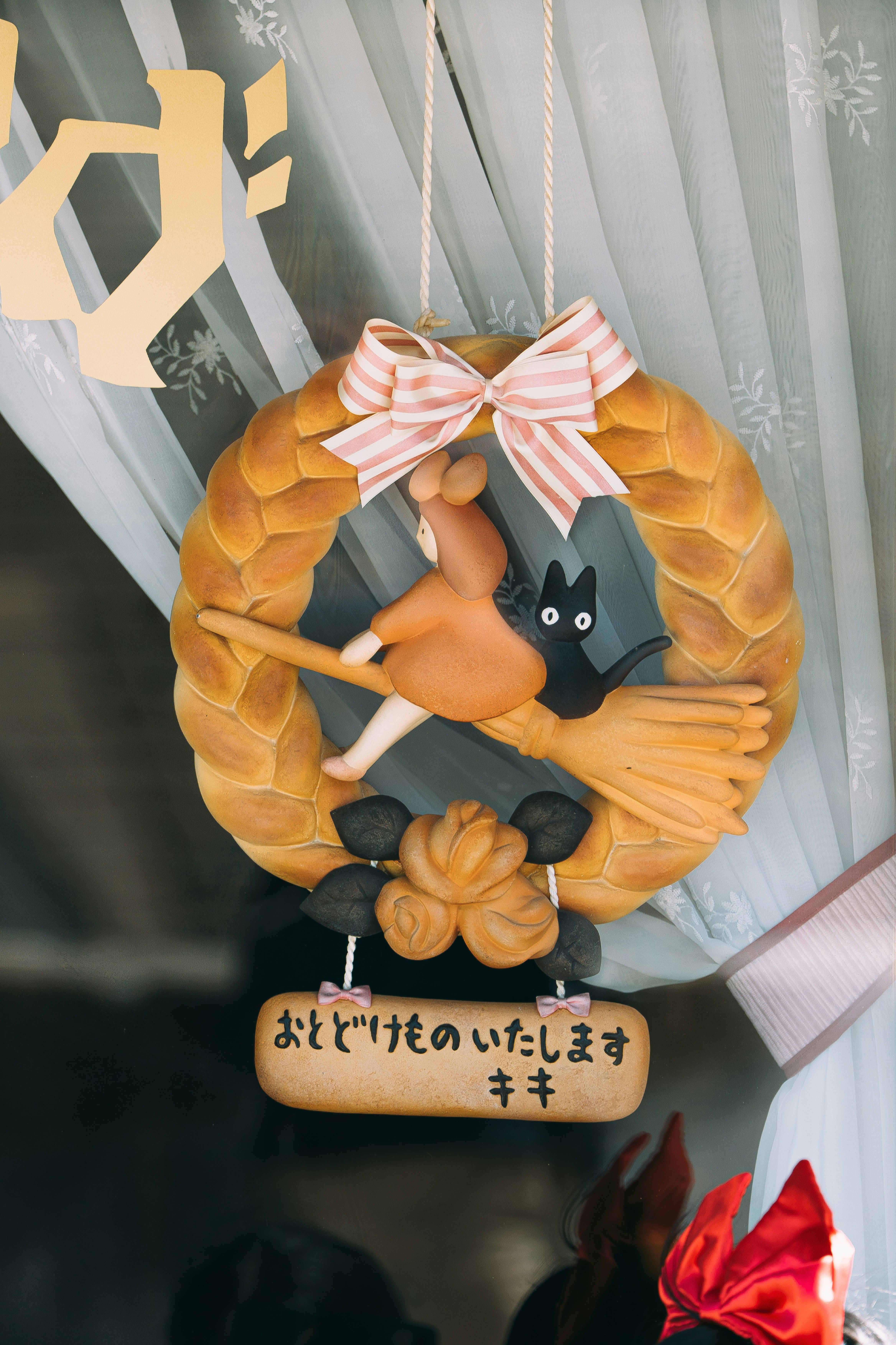 Wreath of Whimsy: A Playful Cat and Bunny Embrace