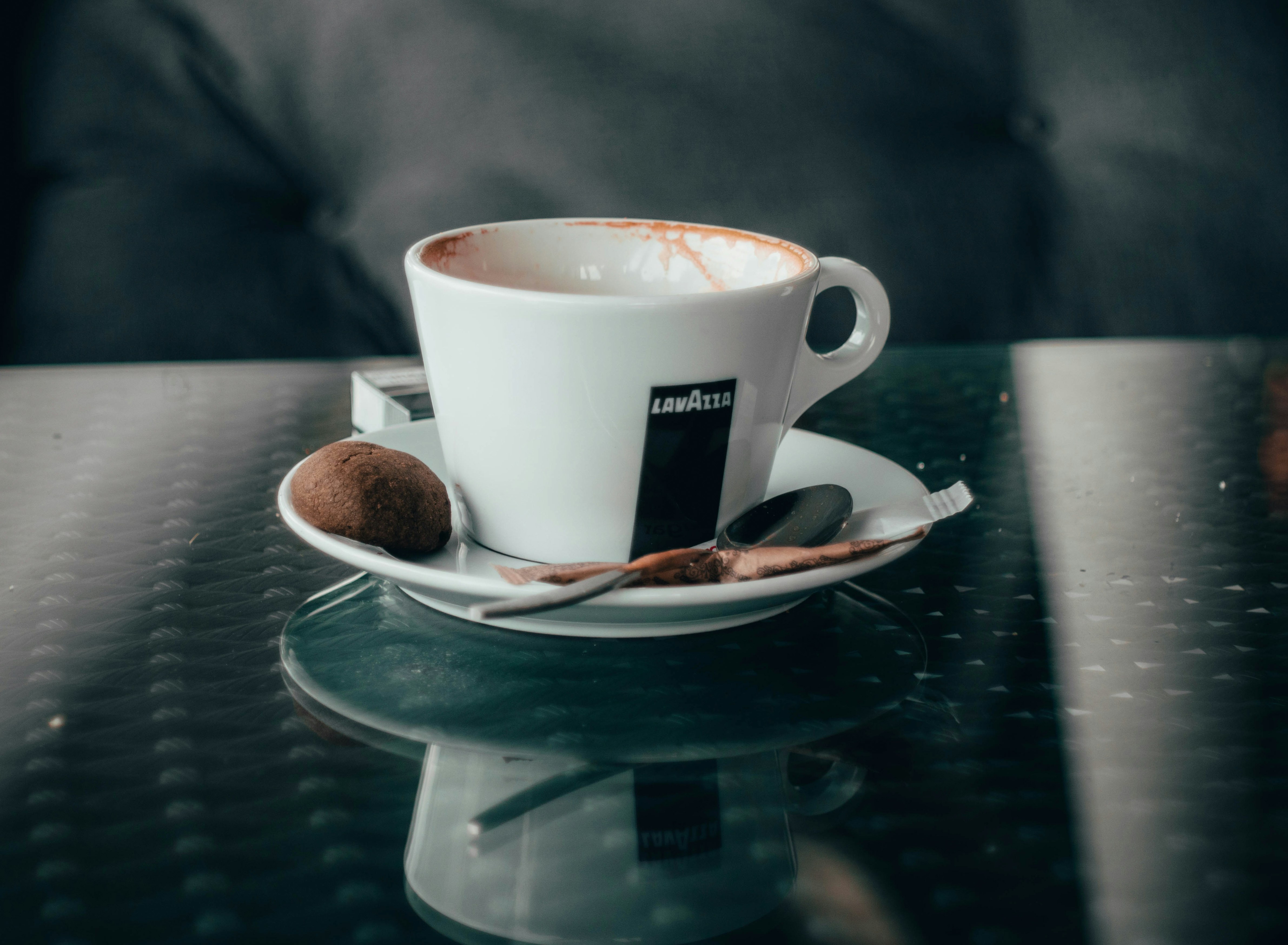 Cup of Quiet: Espresso Steam and Reflection on a Glass Table