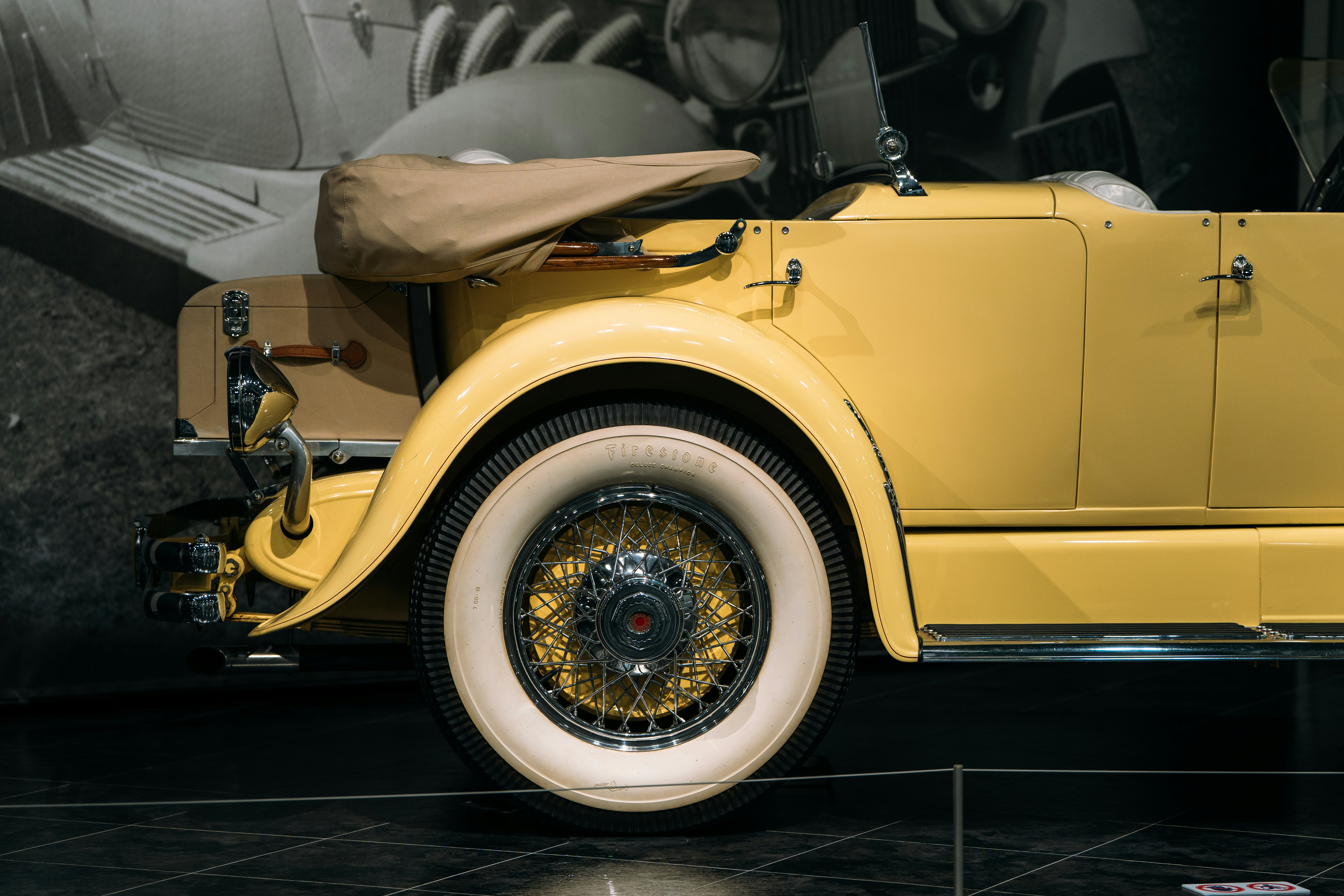Golden Chassis: Classic Cabriolet Resting in the Spotlight