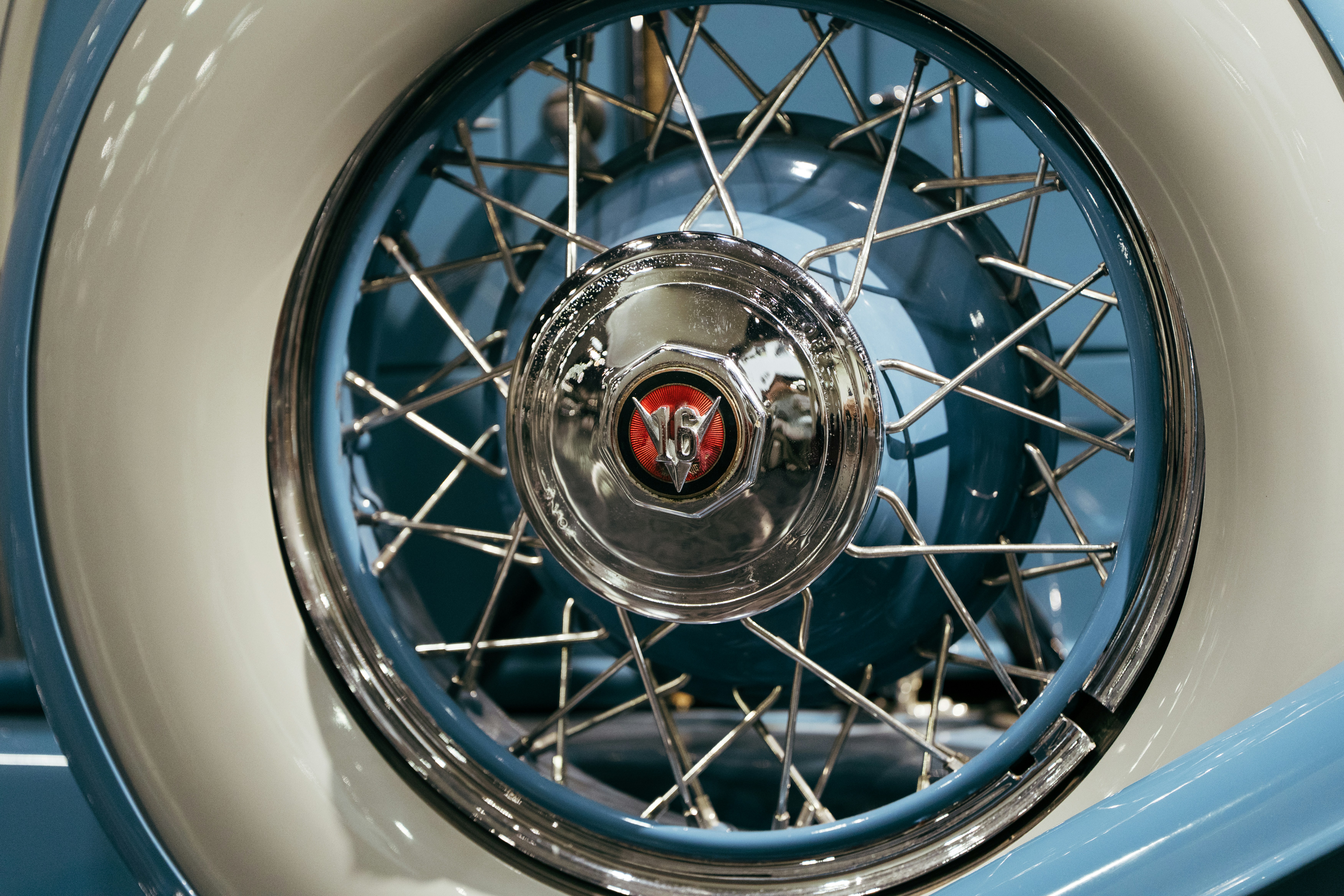 Spoked Symphony: A Classic Car Wheel and Hubcap in Focus
