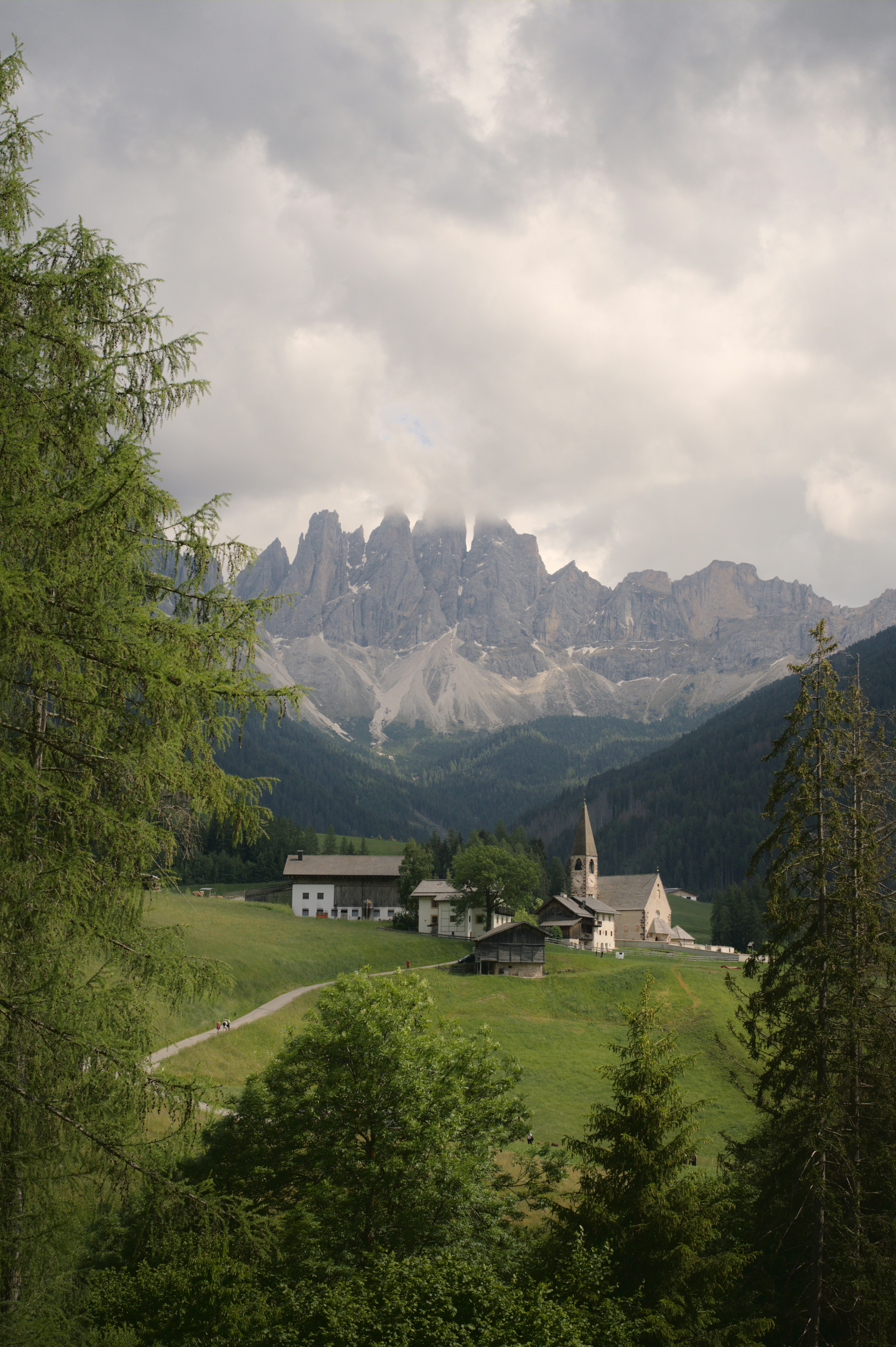  Alpine Village Beneath Towering Peaks at Dusk