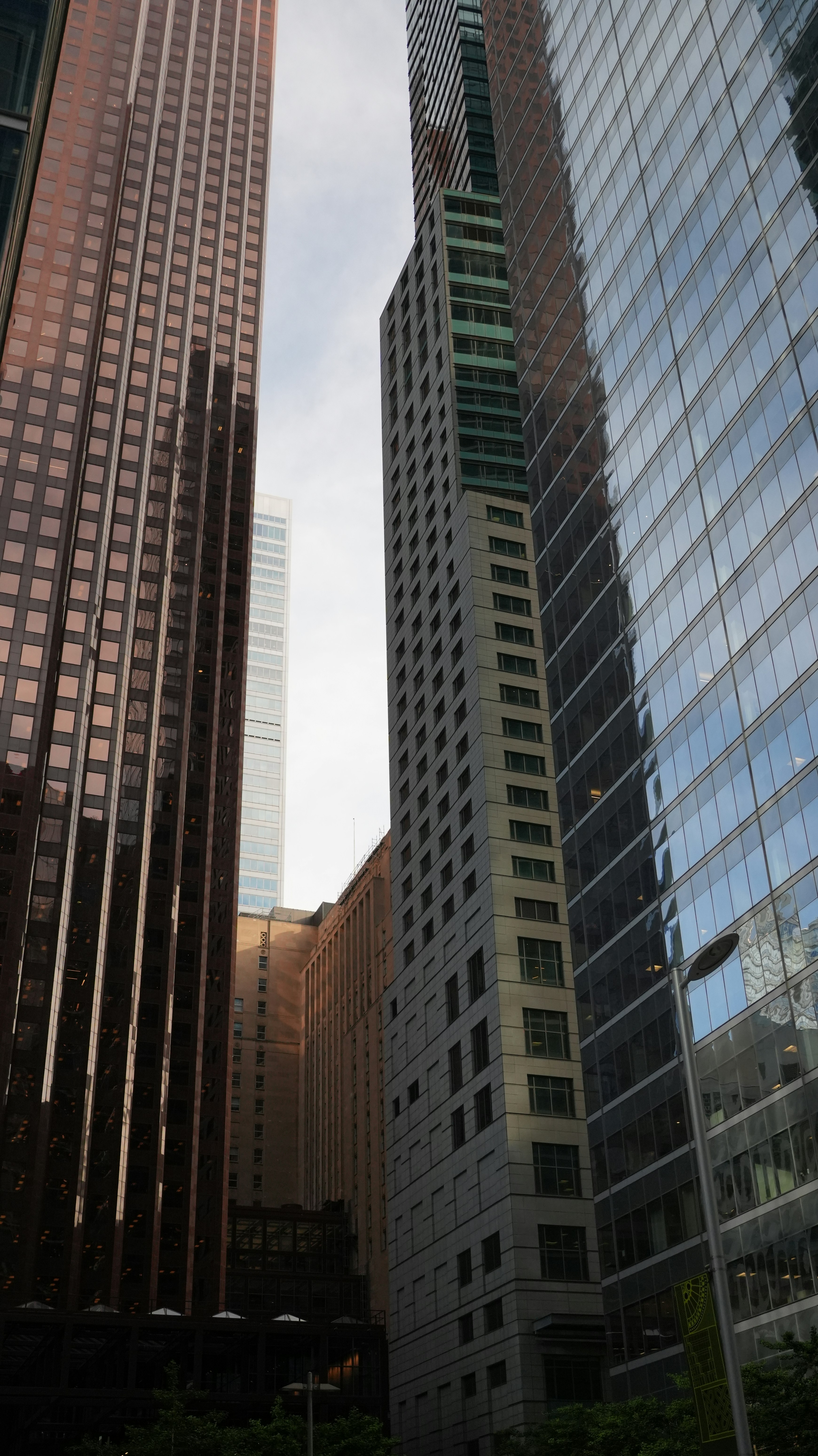 Vertical Cityscape: Towers Converge in a Glassy Sky