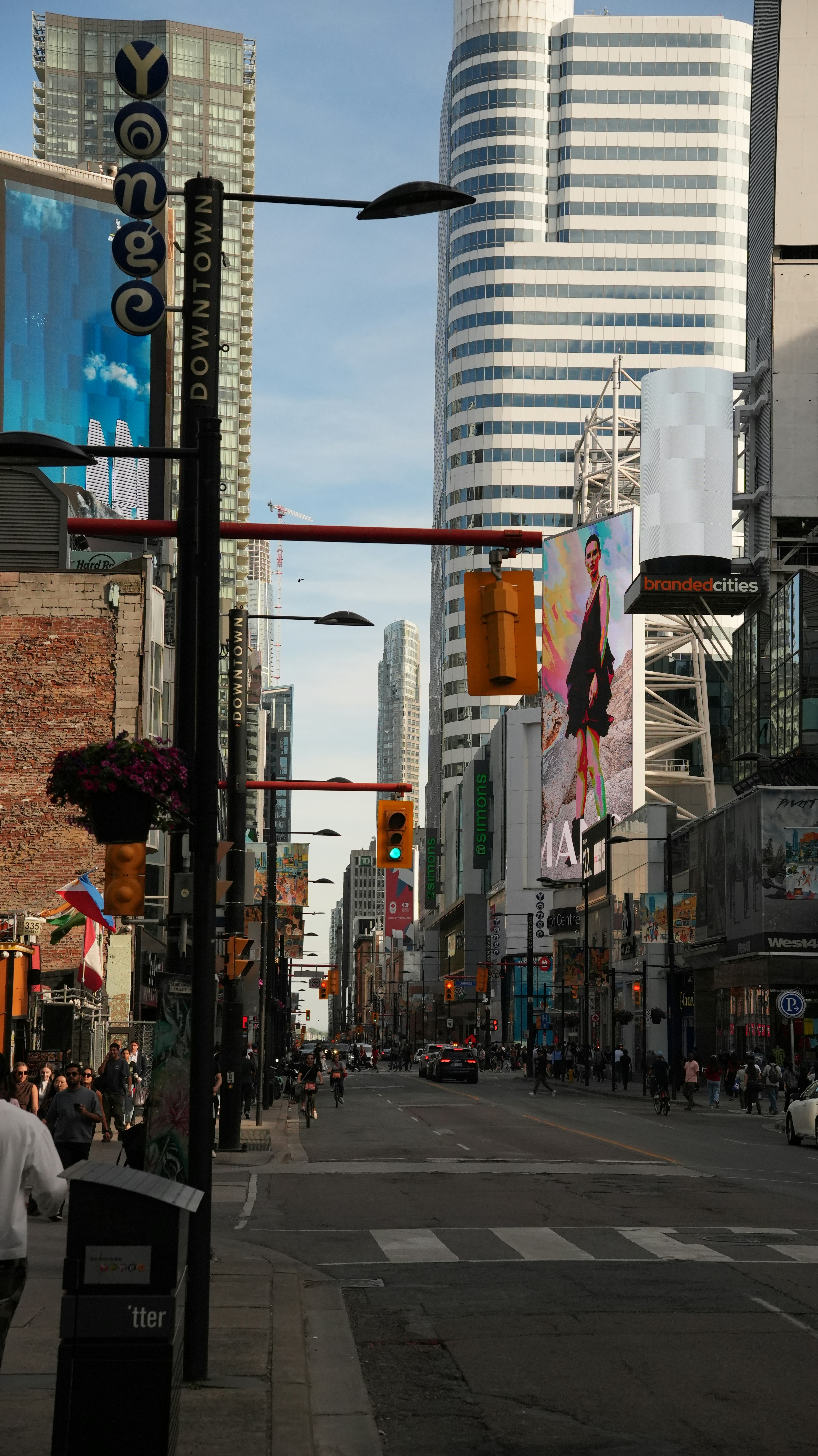 City Pulse: Neon Signage and Skyscrapers Framing the Street