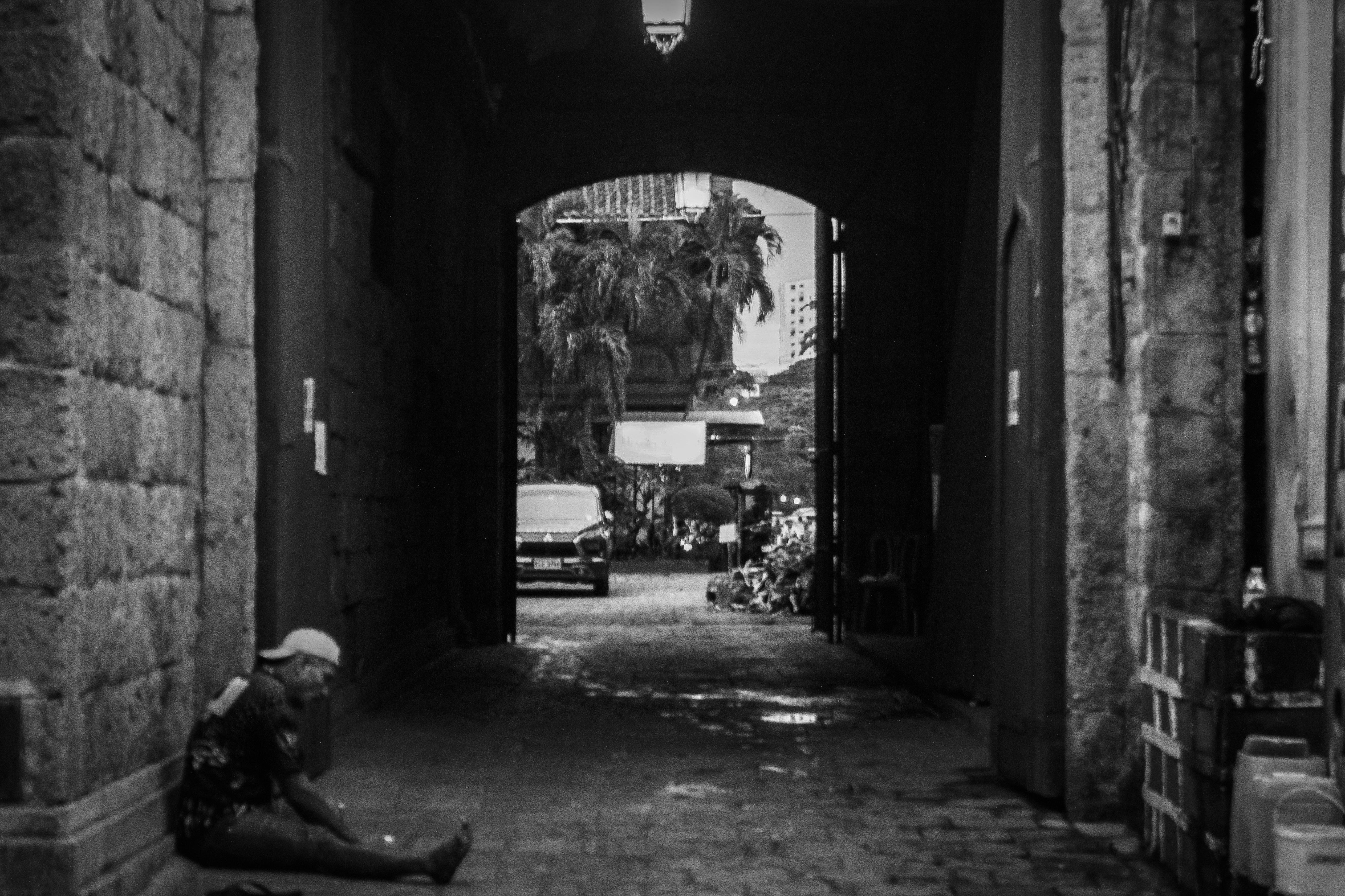 Shadowed Alleyways: A Quiet Moment of Resilience