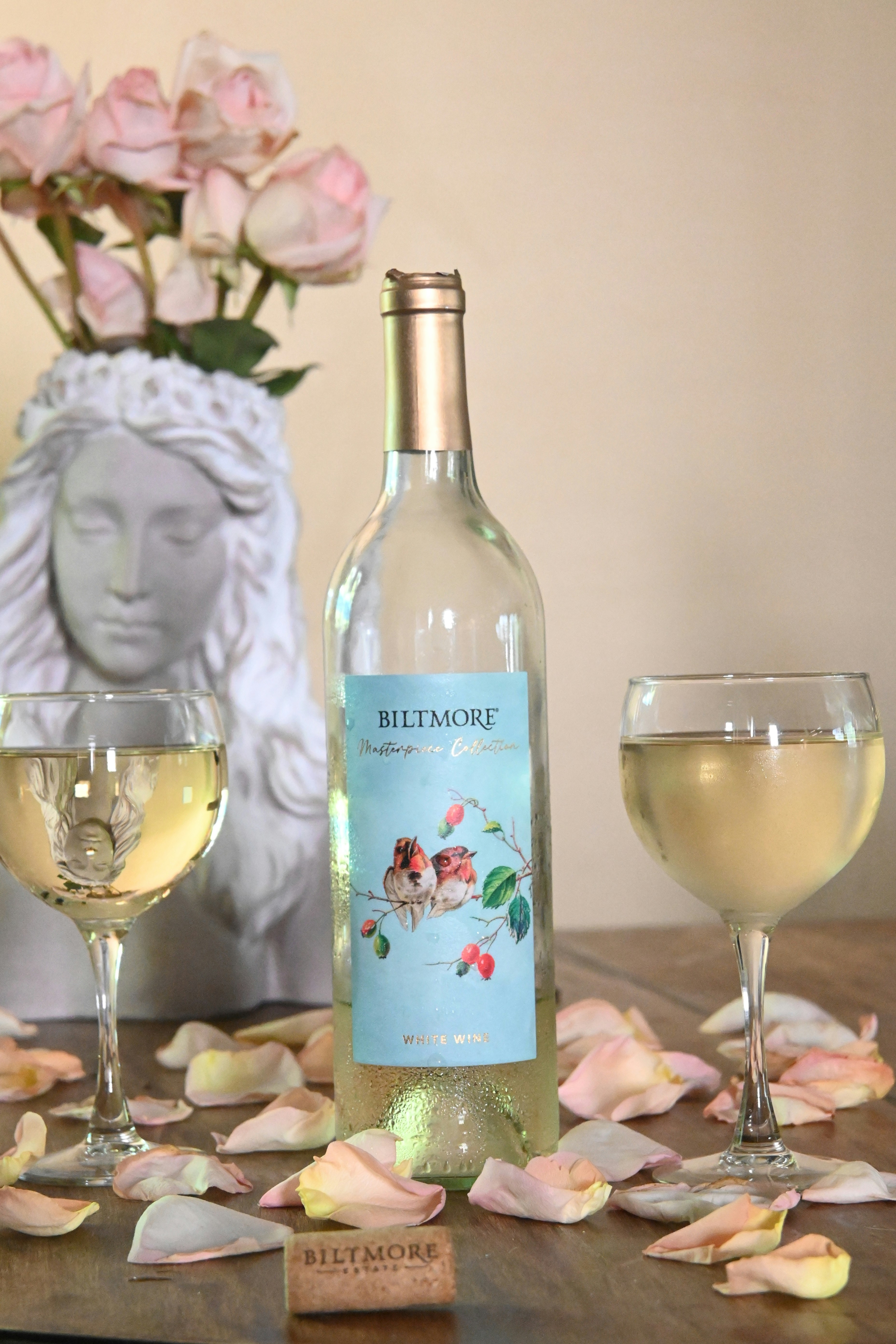 Bottled Nectar: A Still Life of Wine, Petals, and Rose-Soft Light