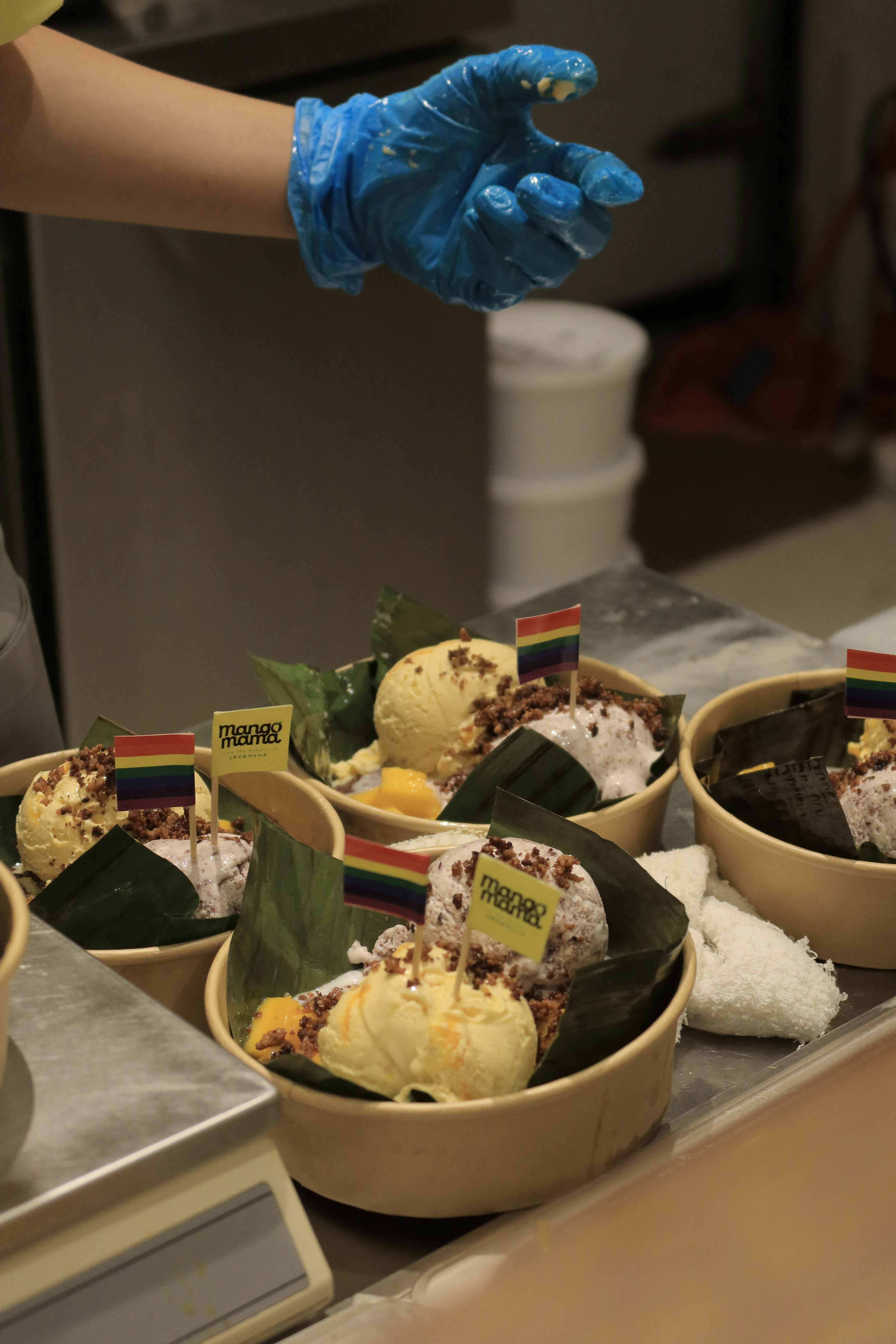 Gloved Hand Over Dessert Stations: A Glimpse into the Kitchen’s Creative Prep