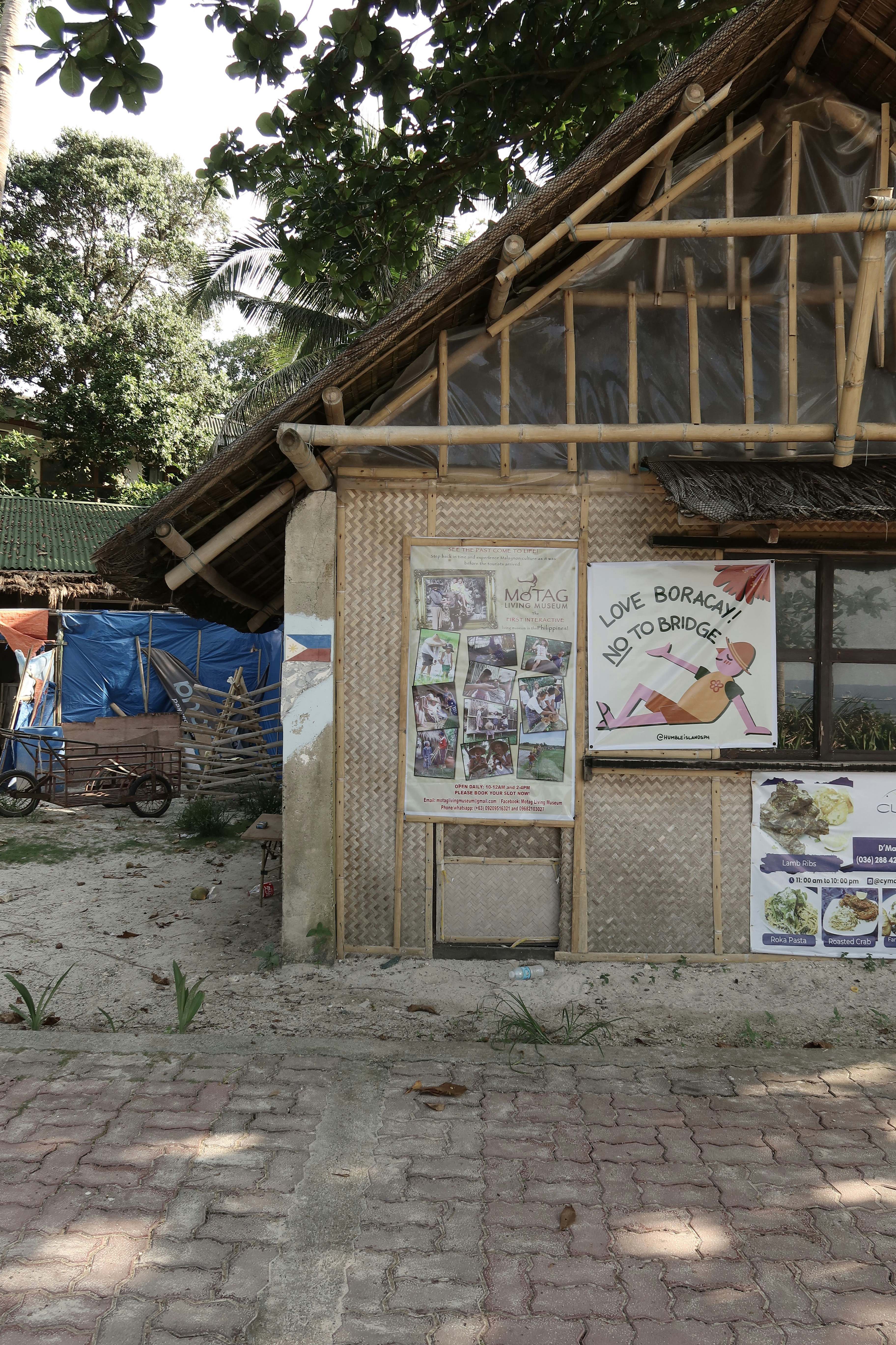 Rattan-roofed Shopfront with Poster Montage