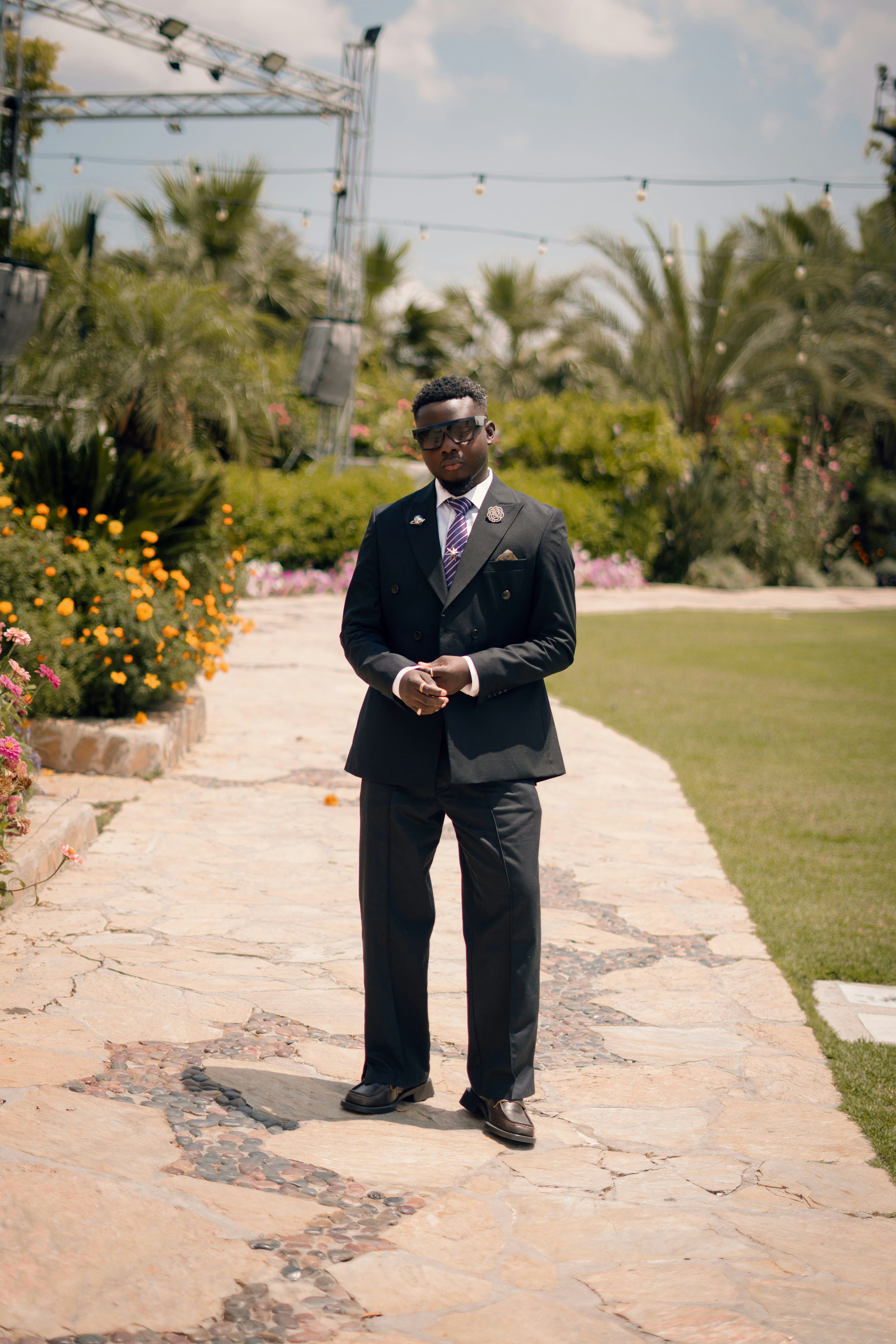 Well-Dressed Guardian: A Moment on the Garden Path