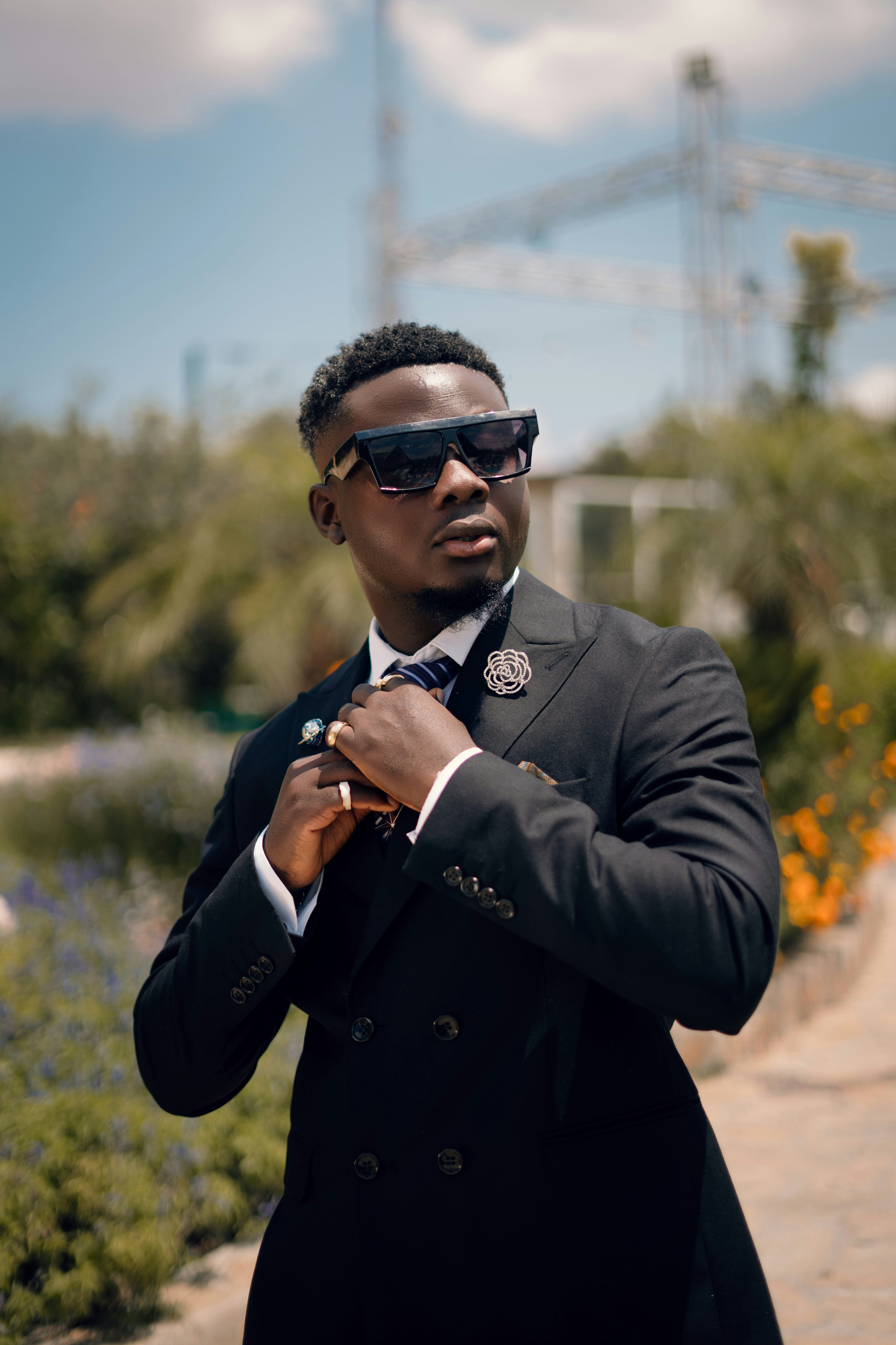  Sharp-Dressed Moment: A Confident Pose Beneath Urban Bloom