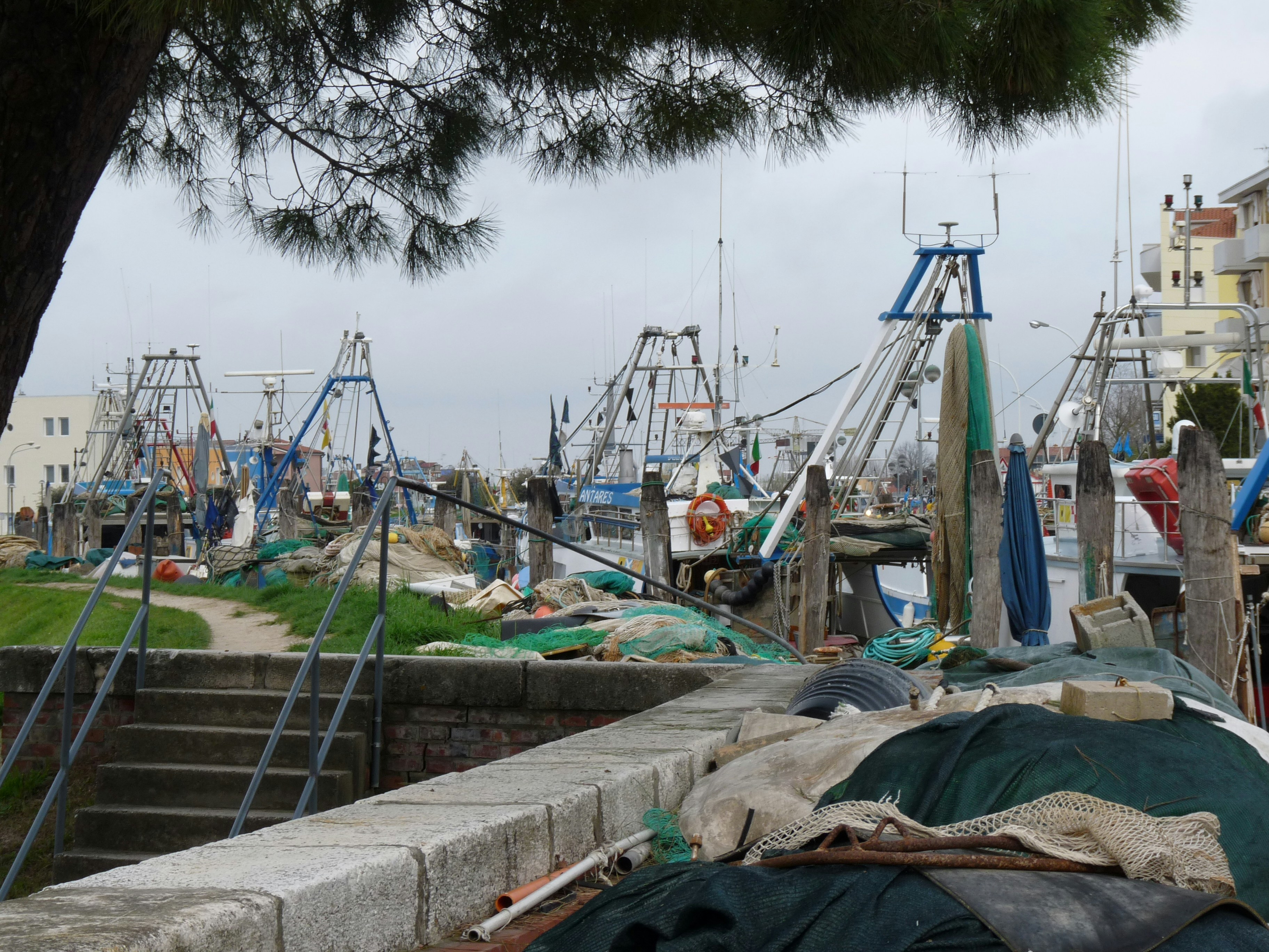 Harbor Tangle: Boats, Nets, and Stones by the Docks