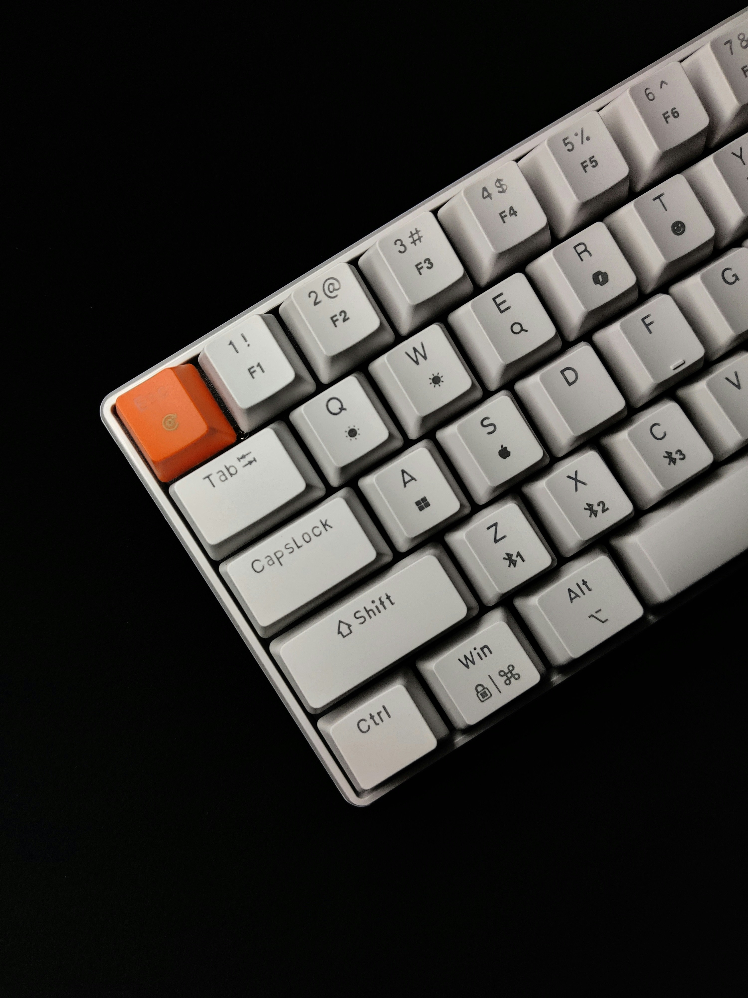Orange Key at the Edge: A Minimalist Keyboard Portrait