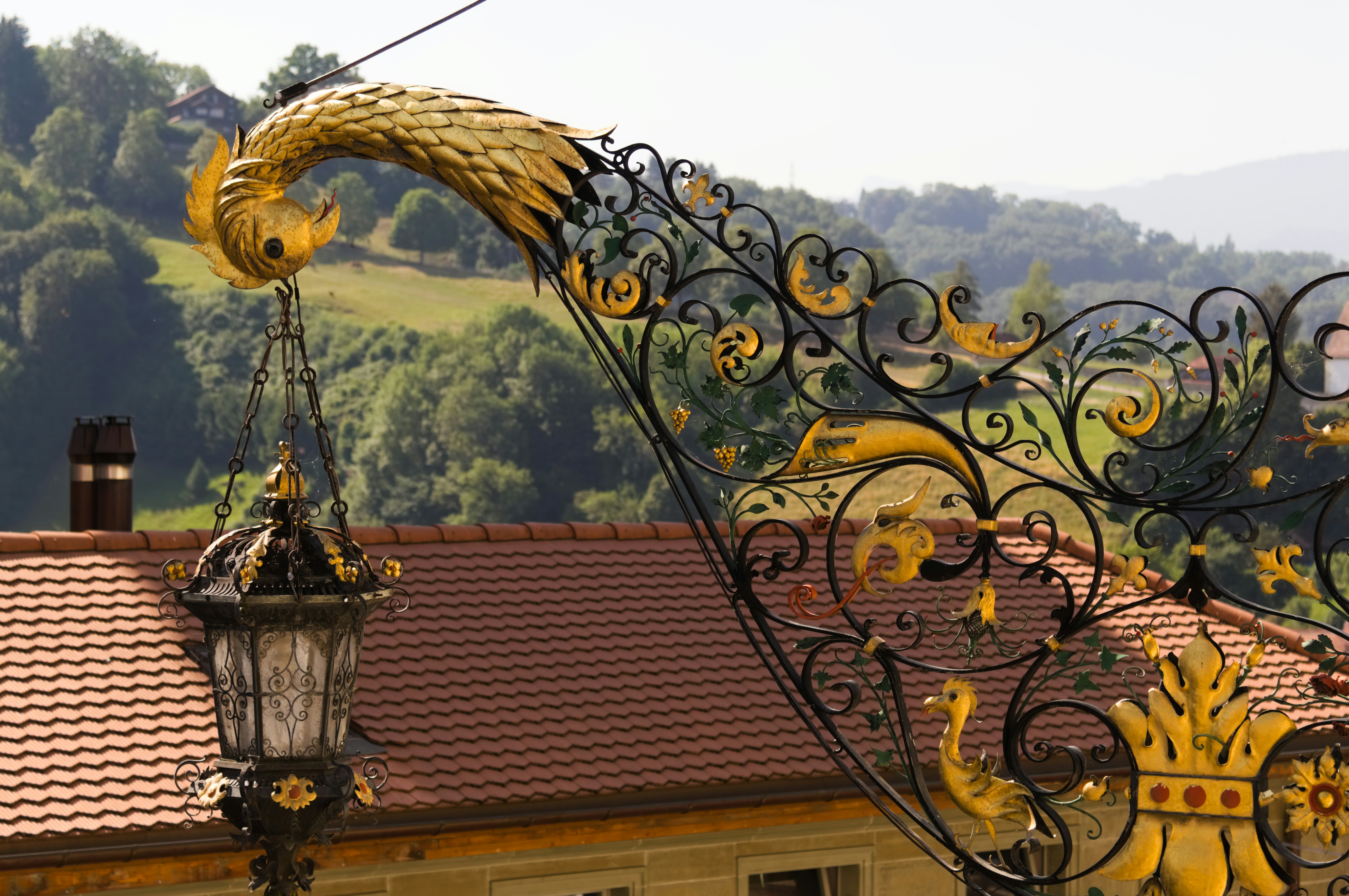 Ornate Dragon Crest Over a Sunlit Rooftop