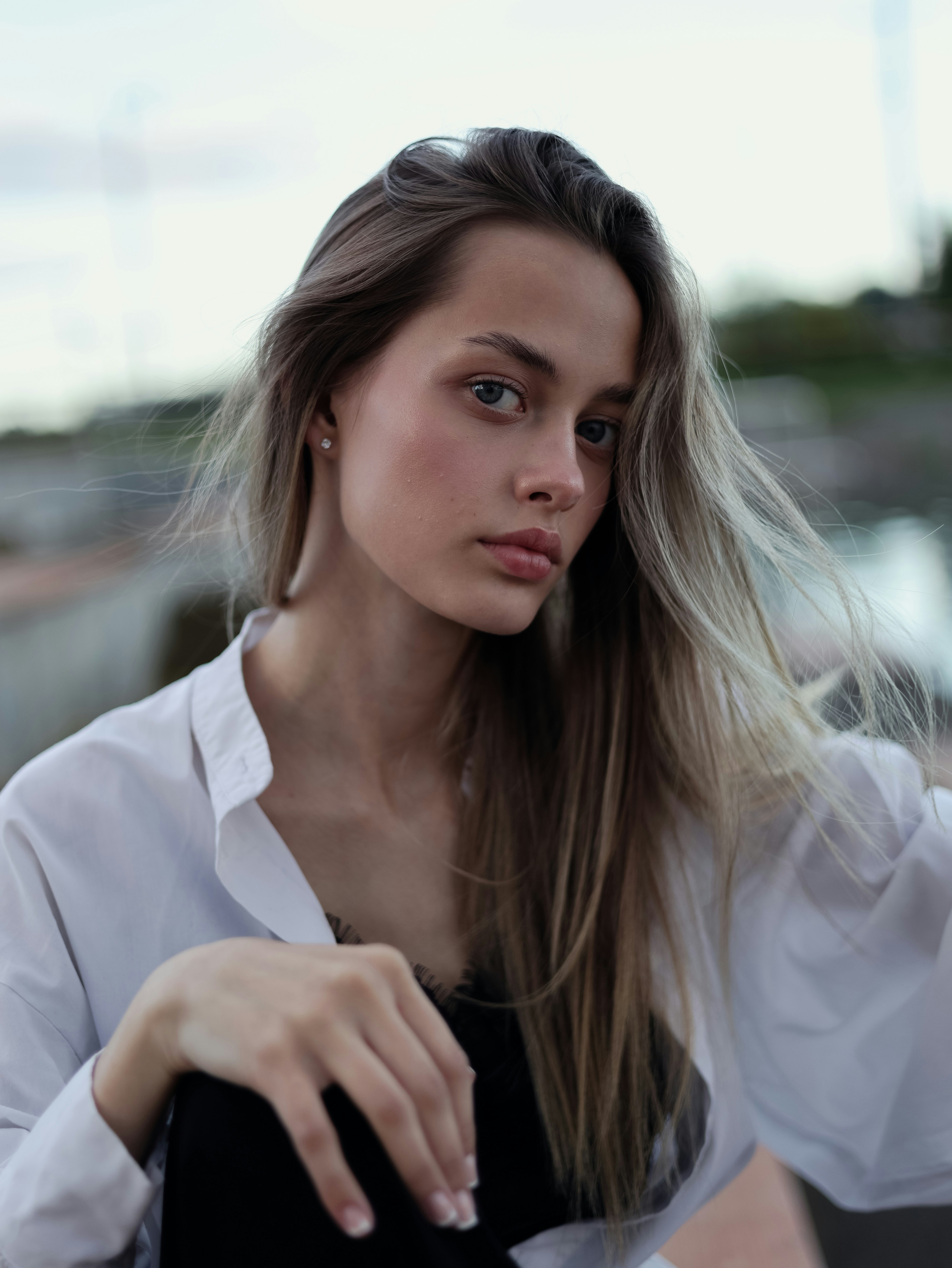 Portrait in soft afternoon light: a contemplative gaze at the dockside