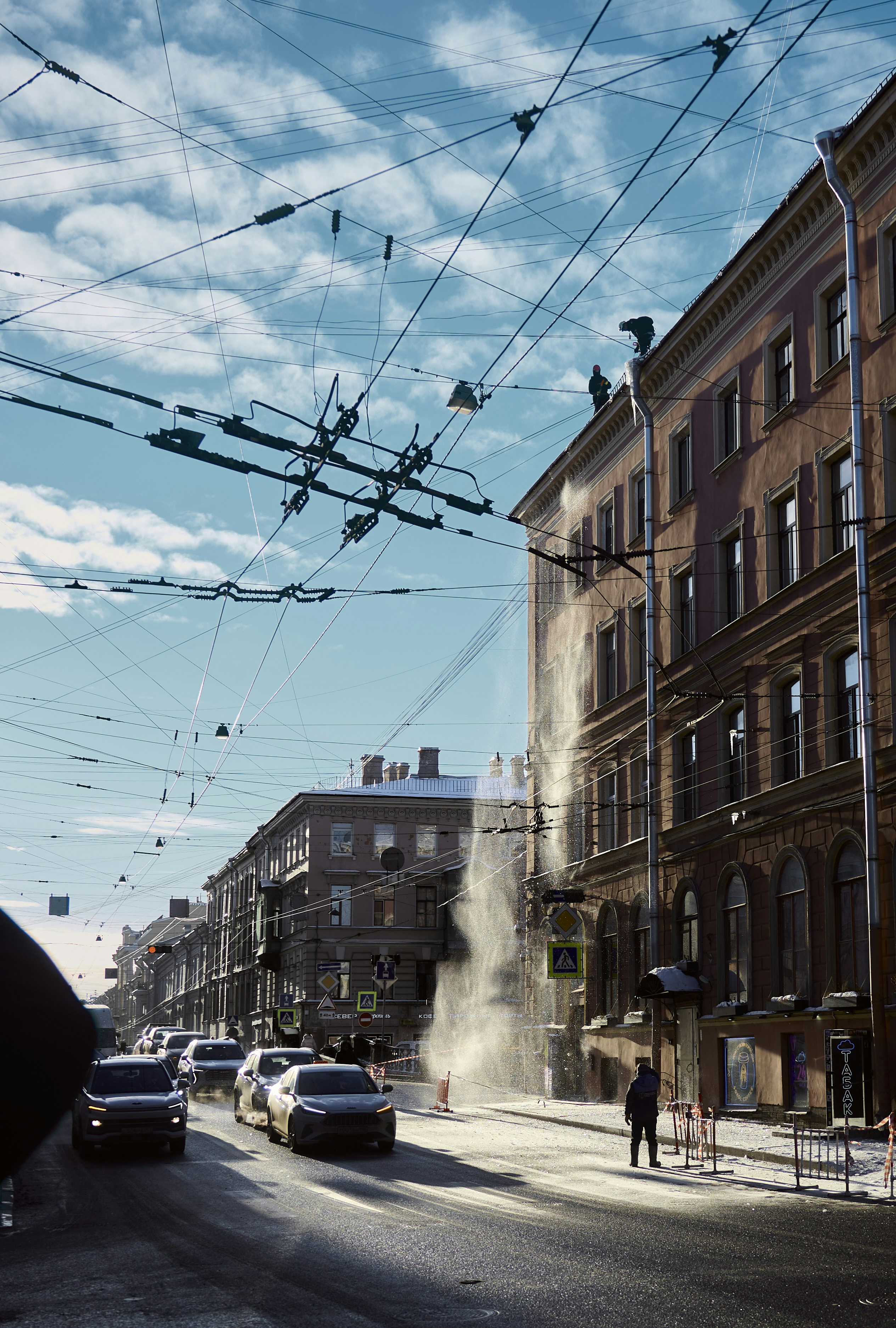 Steam and Cables Over a City Street