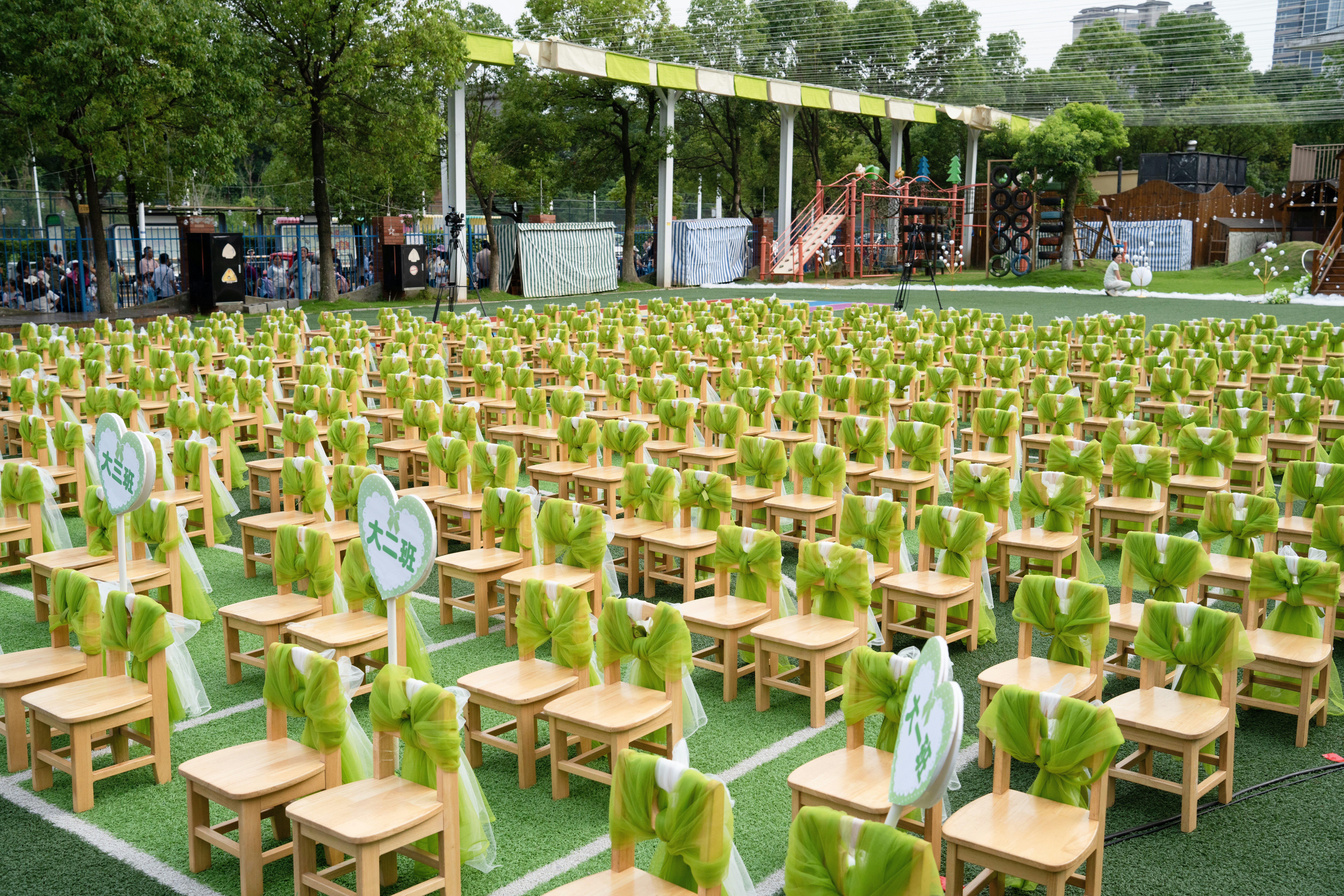 Rows of Green-Cushioned Seats Under a Playground Corridor