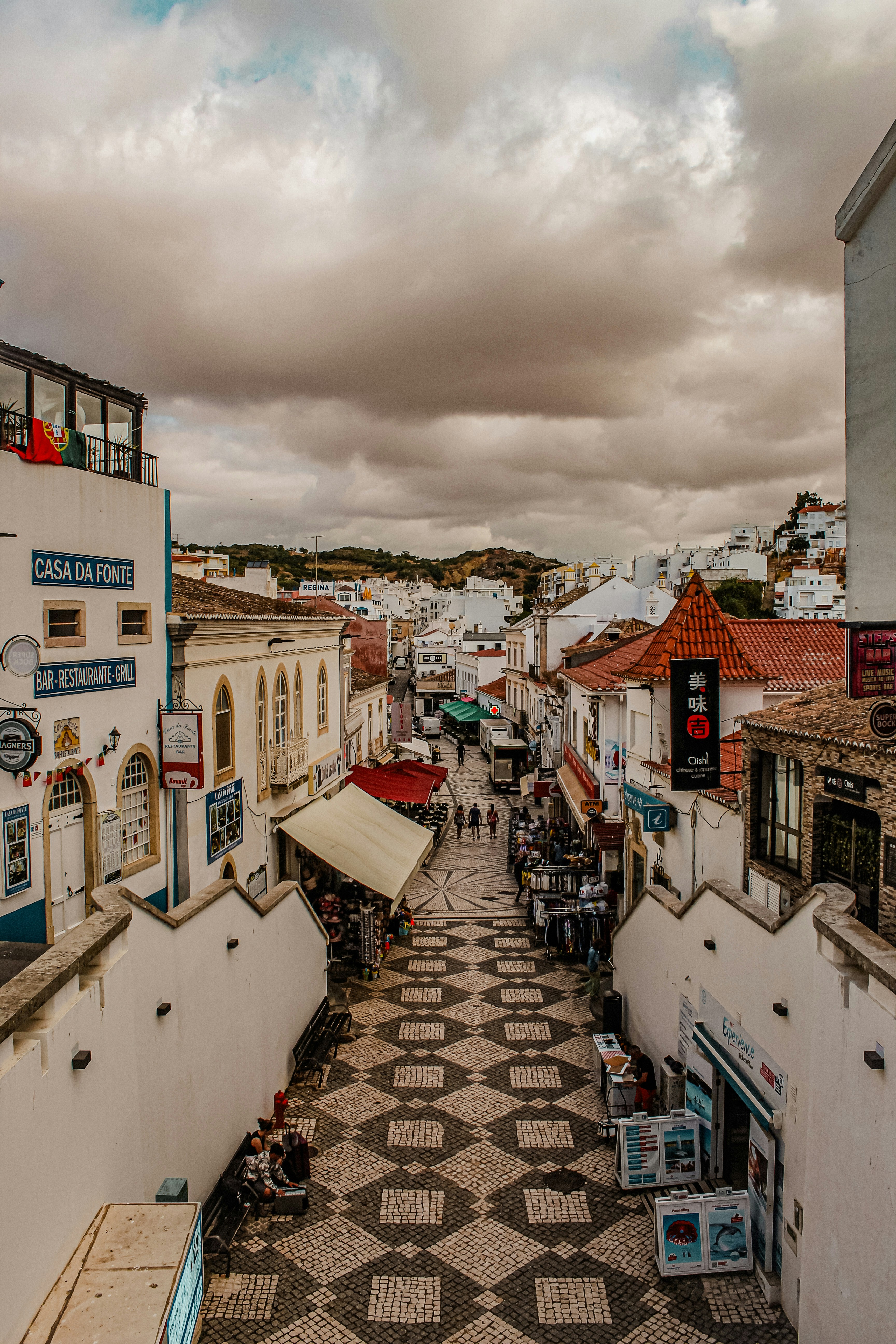 Cobbled Lane Between Sunny Market Nooks in a Coastal Town