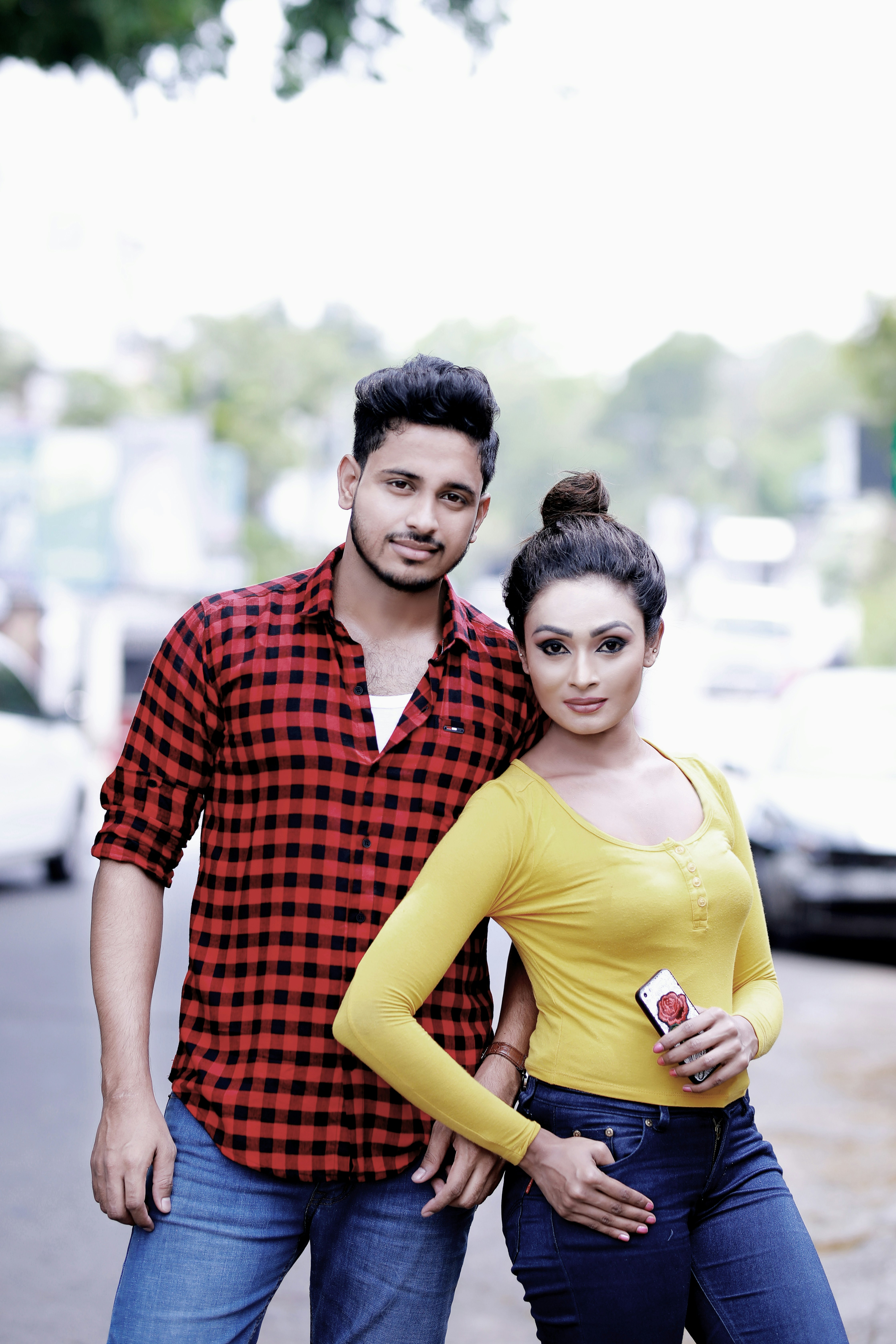 Two people posing on a street. photo – Free Image on Unsplash