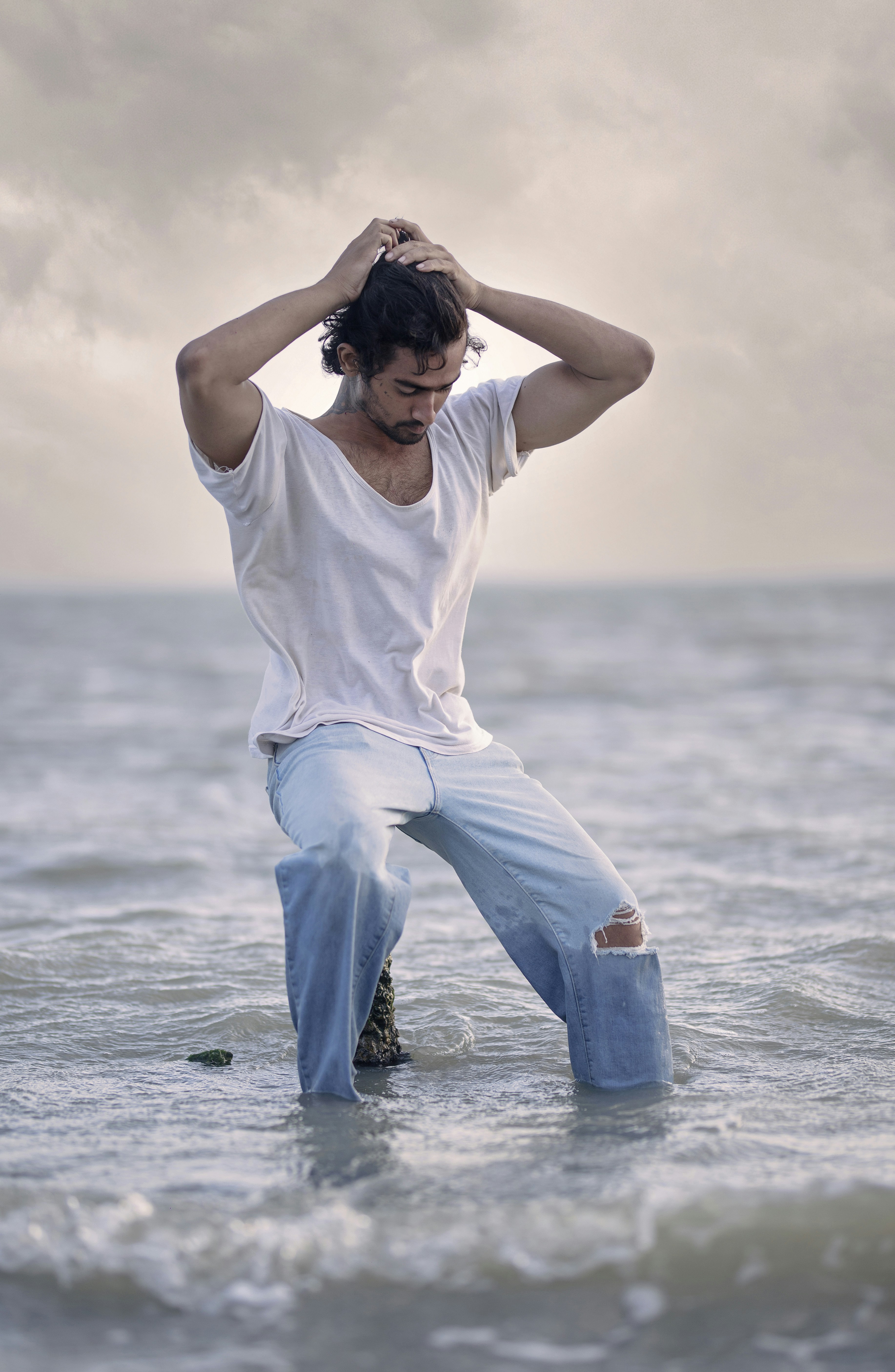 Knee‑deep in the Sea: A Quiet Moment on Shifting Tides