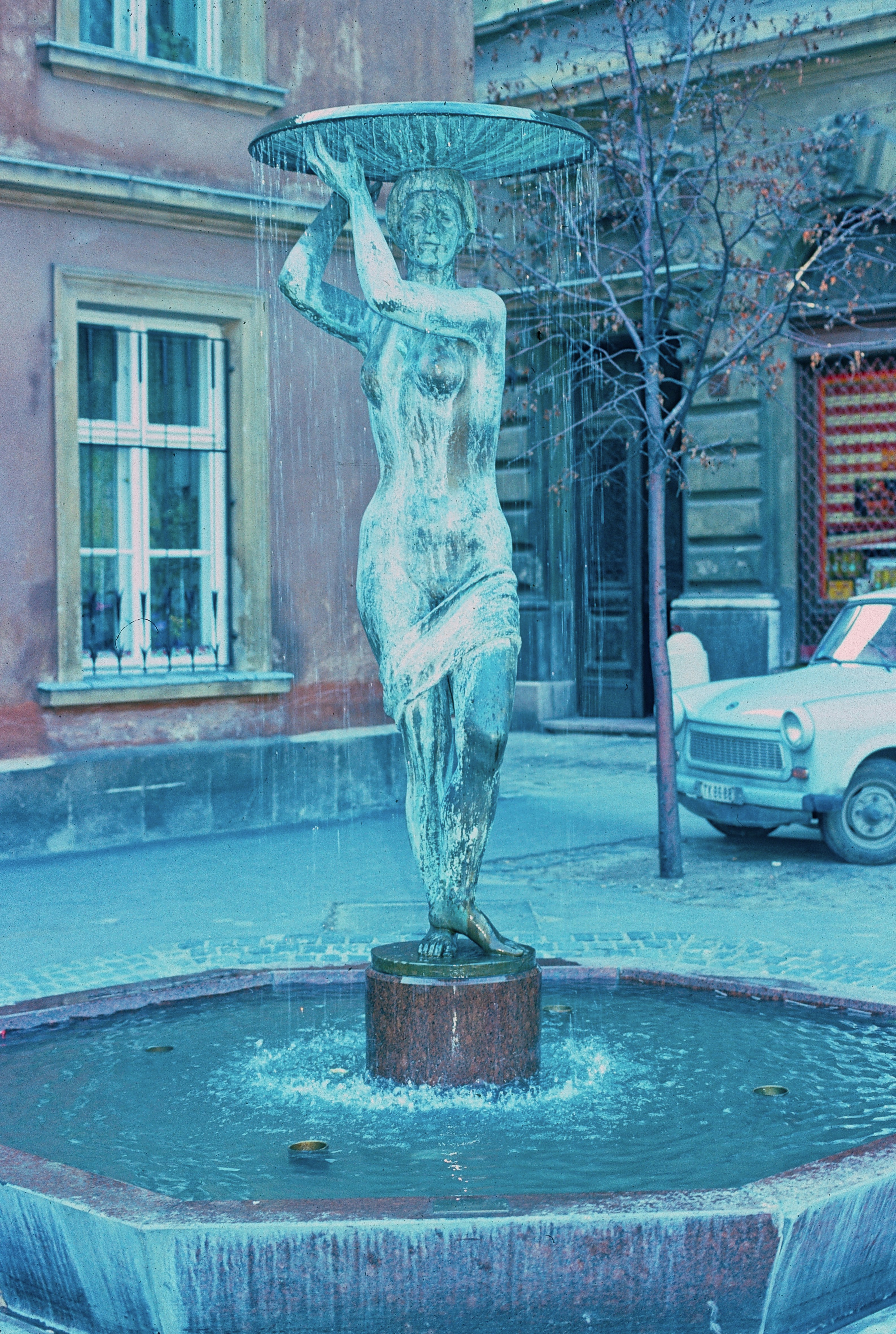 Aqua Statue in a Quiet Street Fountain