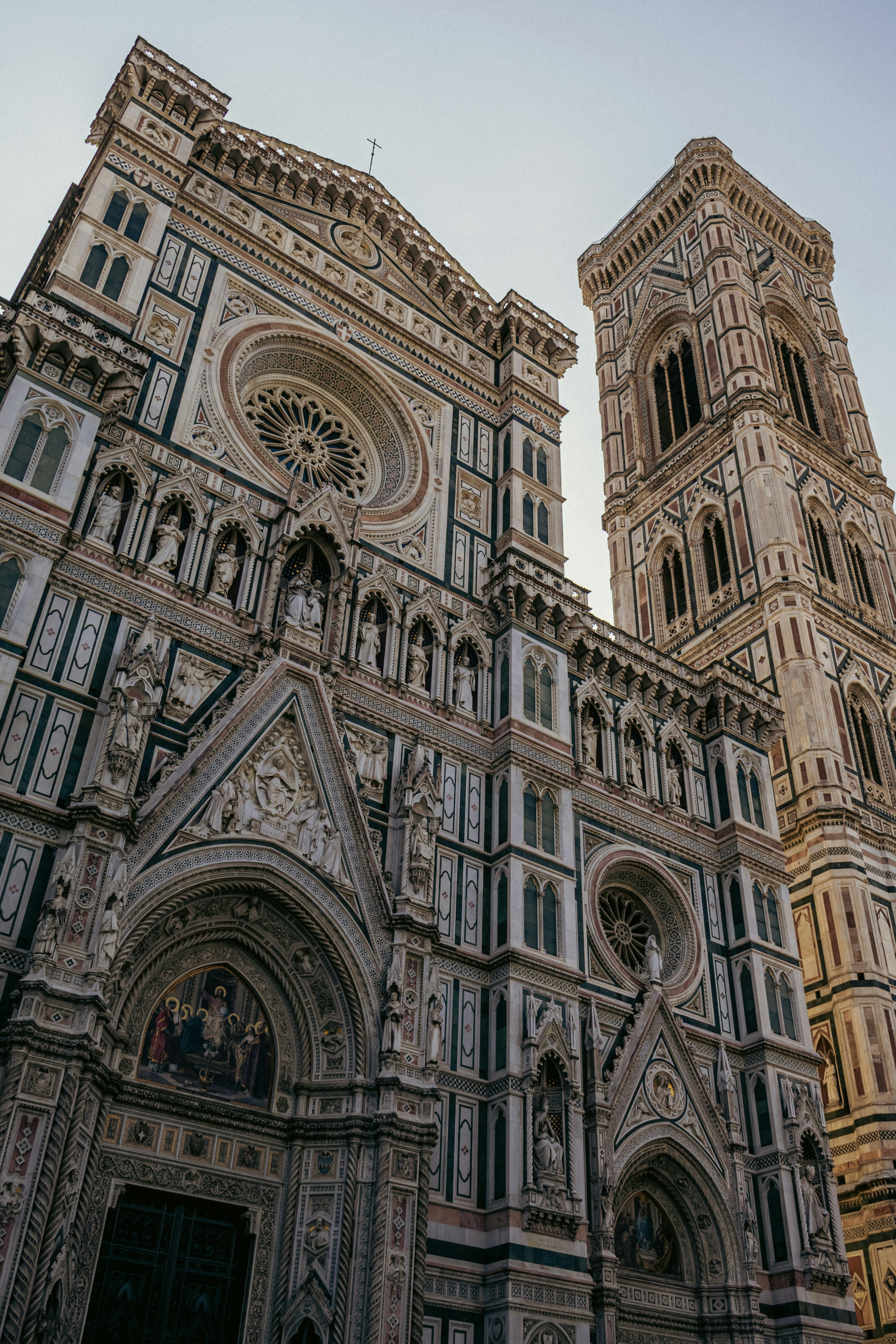 Marble Facade of Florence's Cathedral: Faces in Stone and Rose Window