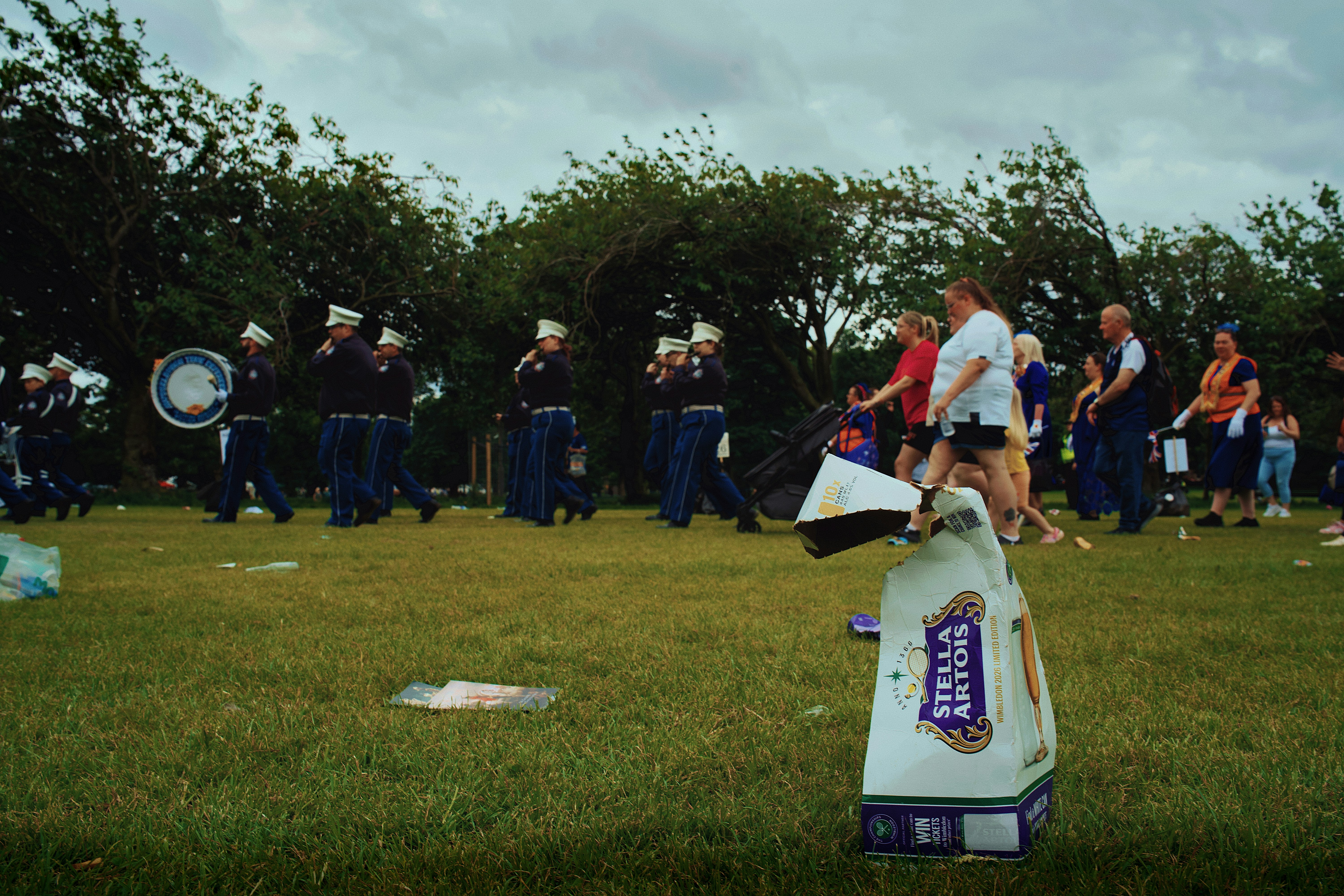 A Quiet Snack Break Amid a Brass Parade
