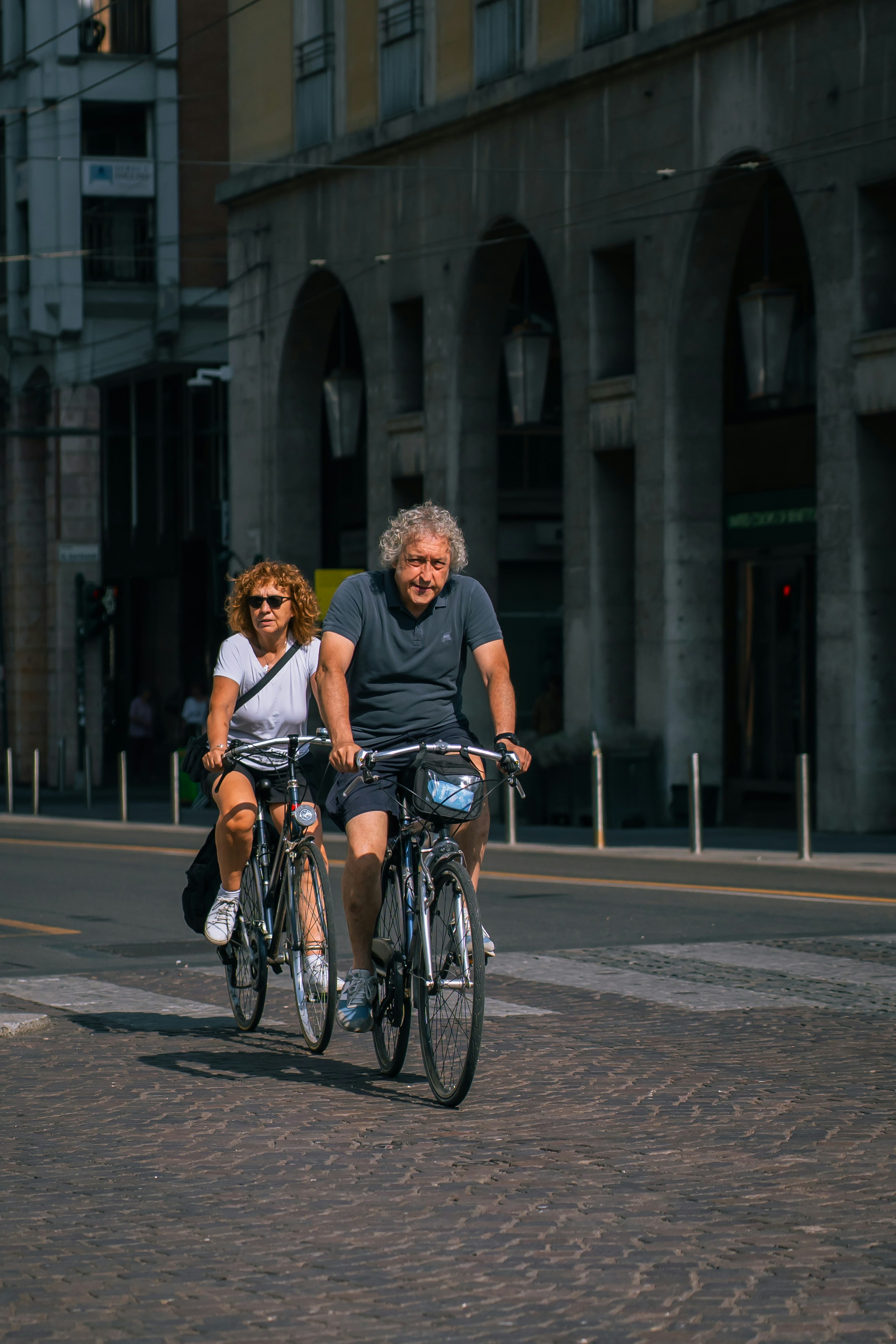 Urban Cyclists Through a Stately Arc