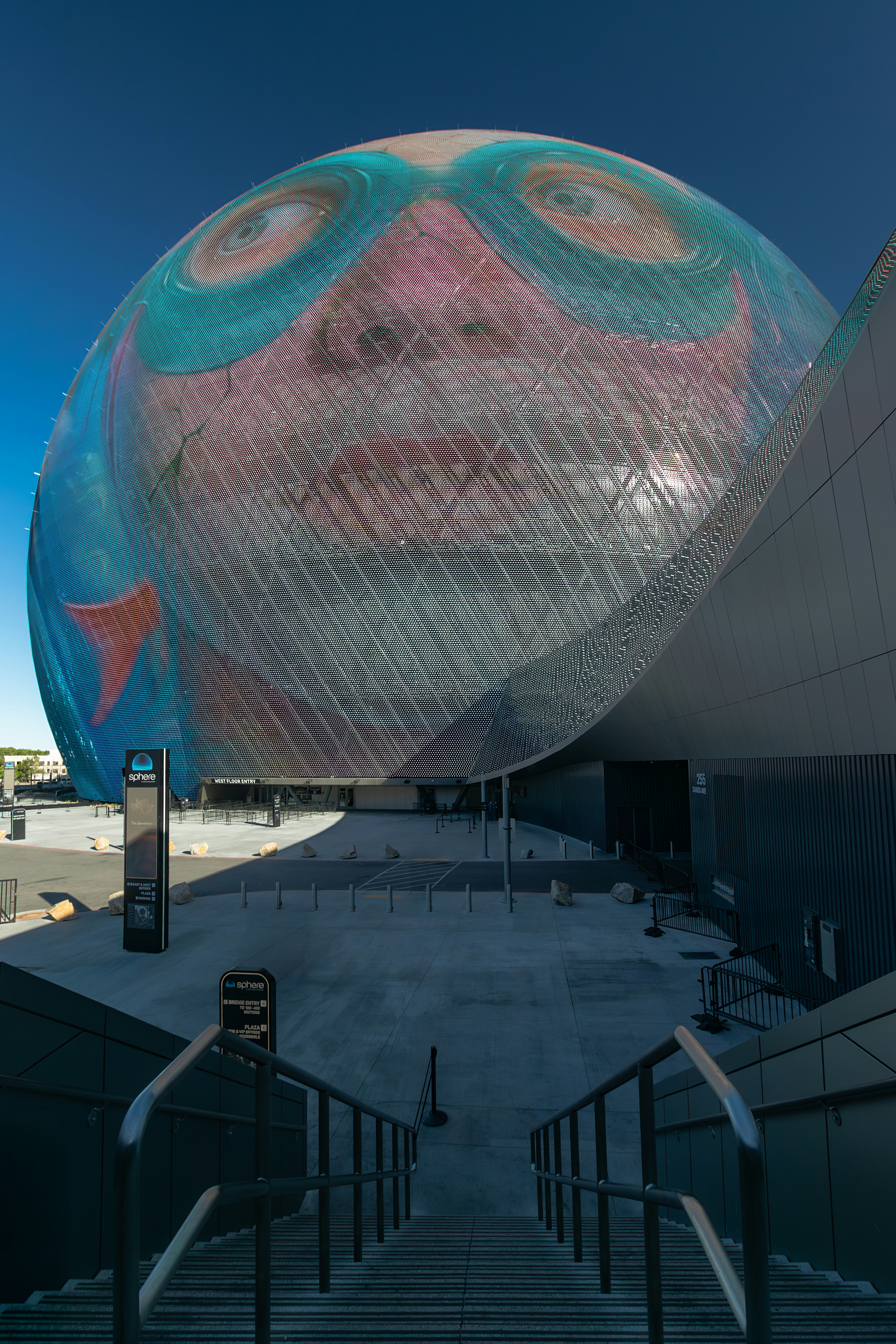 Giant Portrait Balloon Overlook: A Curious Face in the Skylit Facade