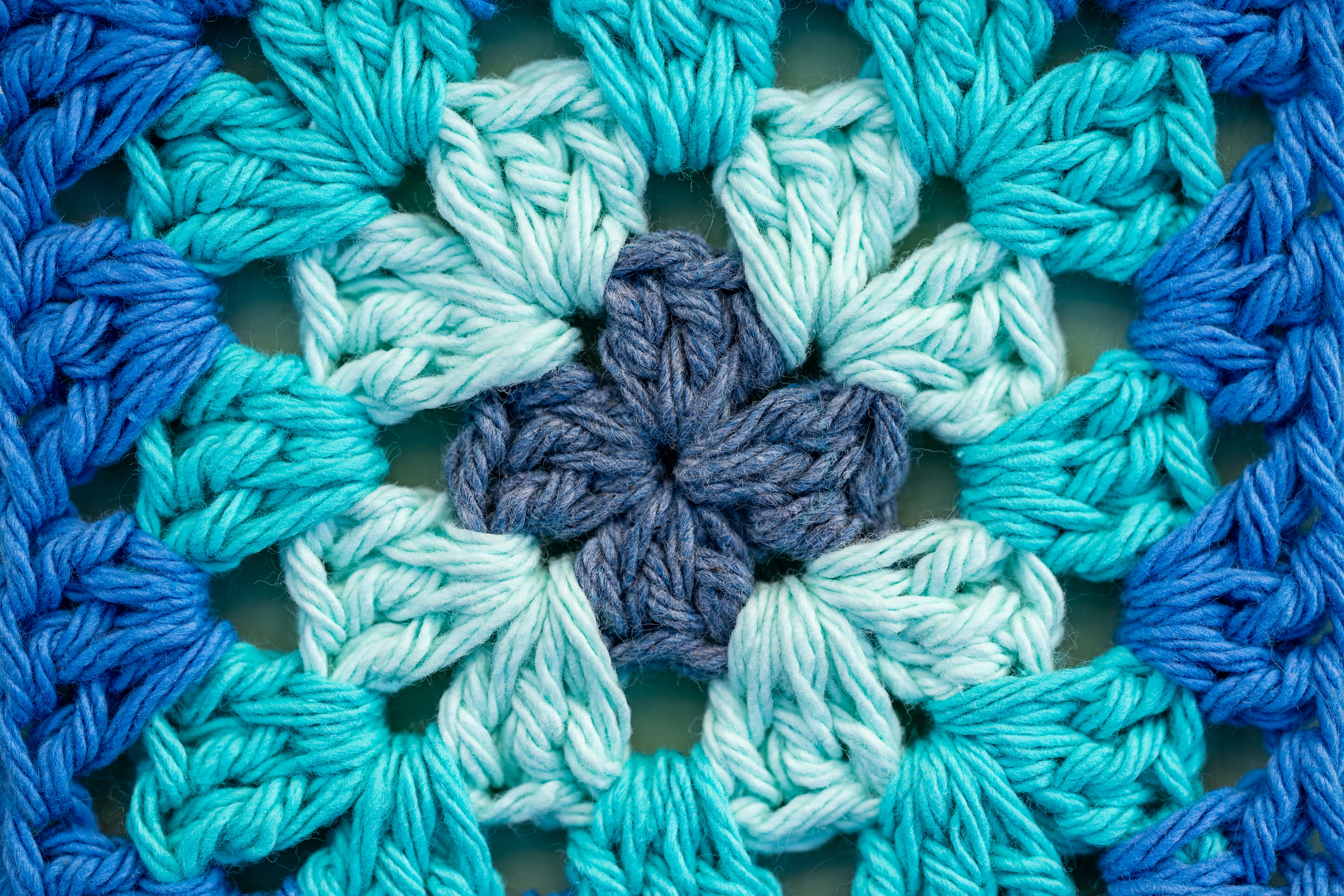 Radiant Blue Crochet Mandala: Layers of Teal and Indigo Petals