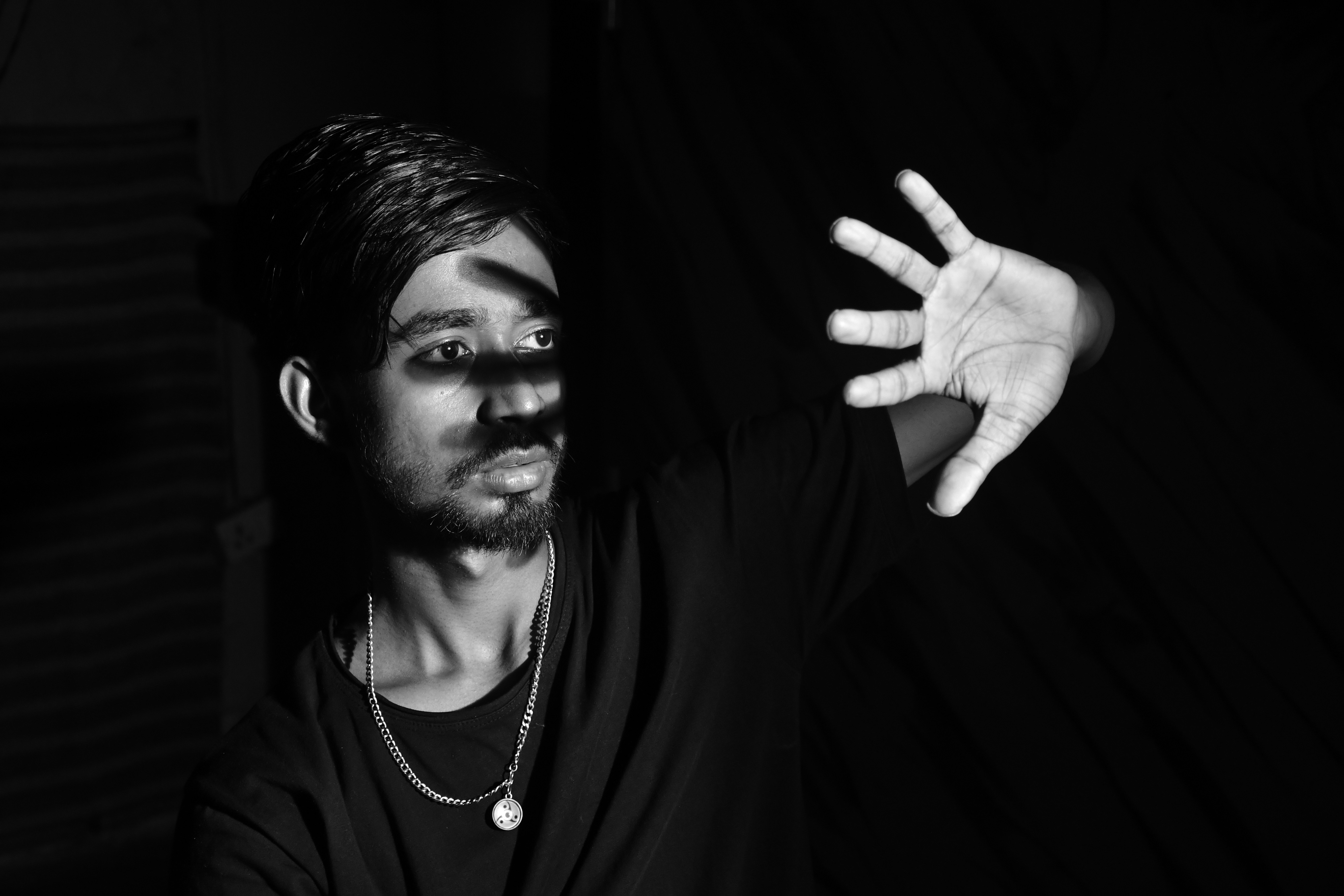 Shadowed Gaze and Outstretched Hand