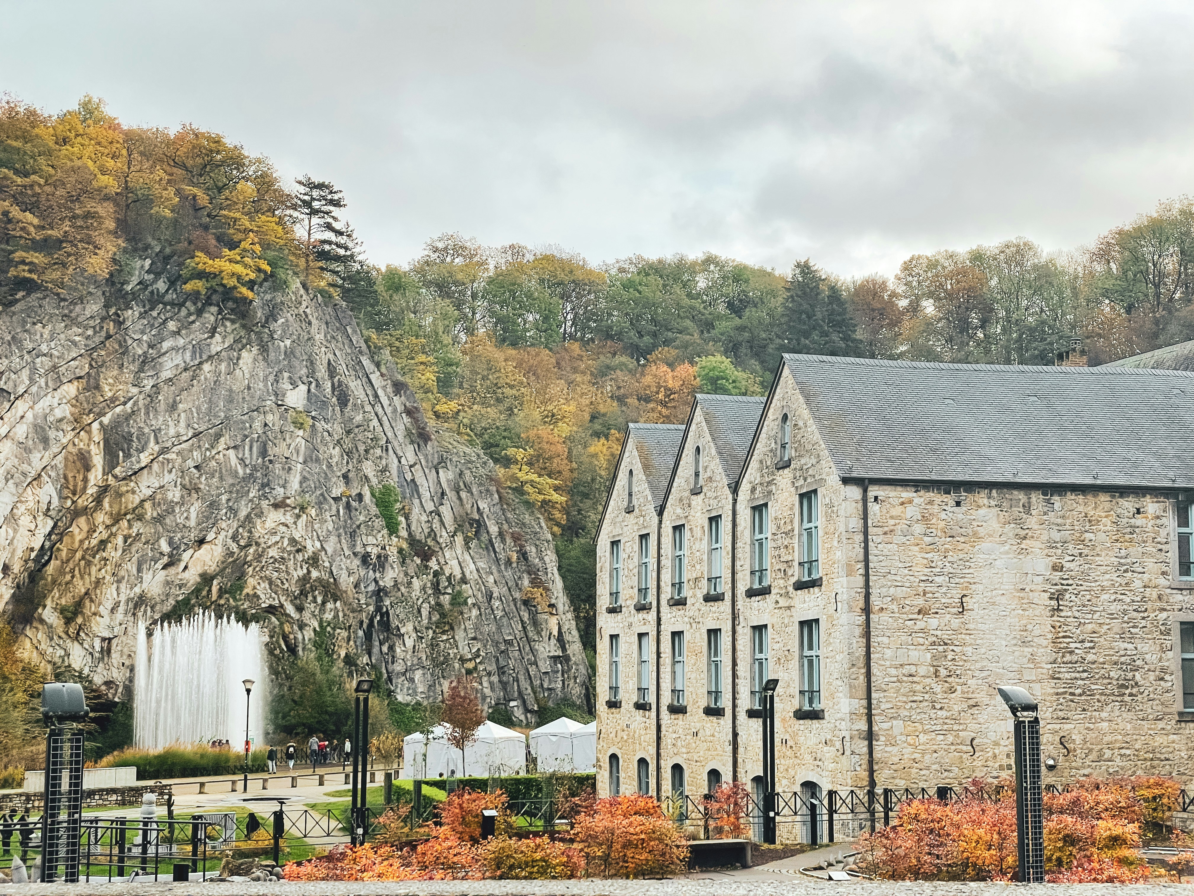 Stone Quarry Heritage: A Riverside Factory Beckons Amid Autumn Cliffside