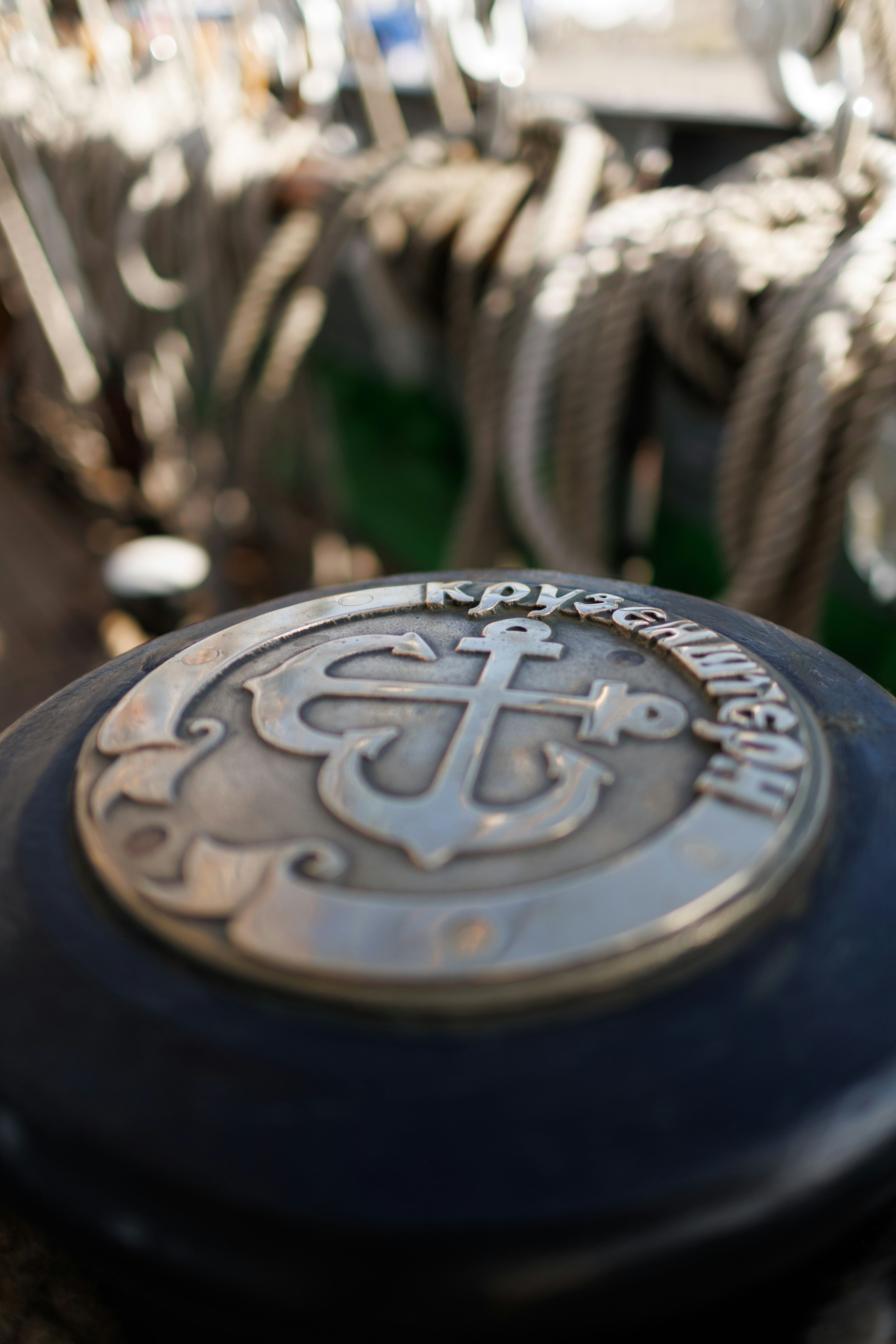 Anchored in Steel: Emblem Geometry on a Weathered Dock Cap