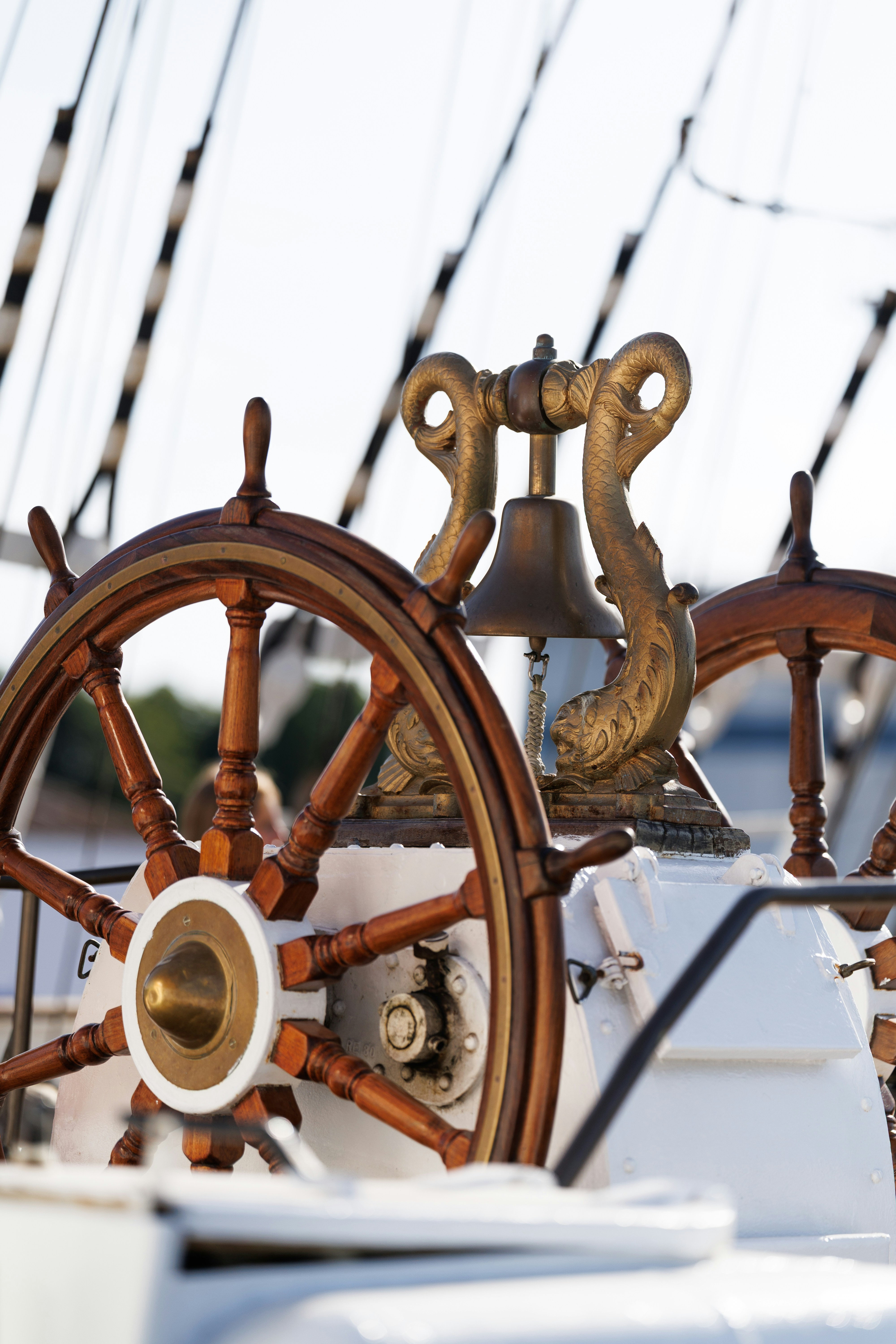 Rotating History: The Ship’s Wheel and Bell at Dawn
