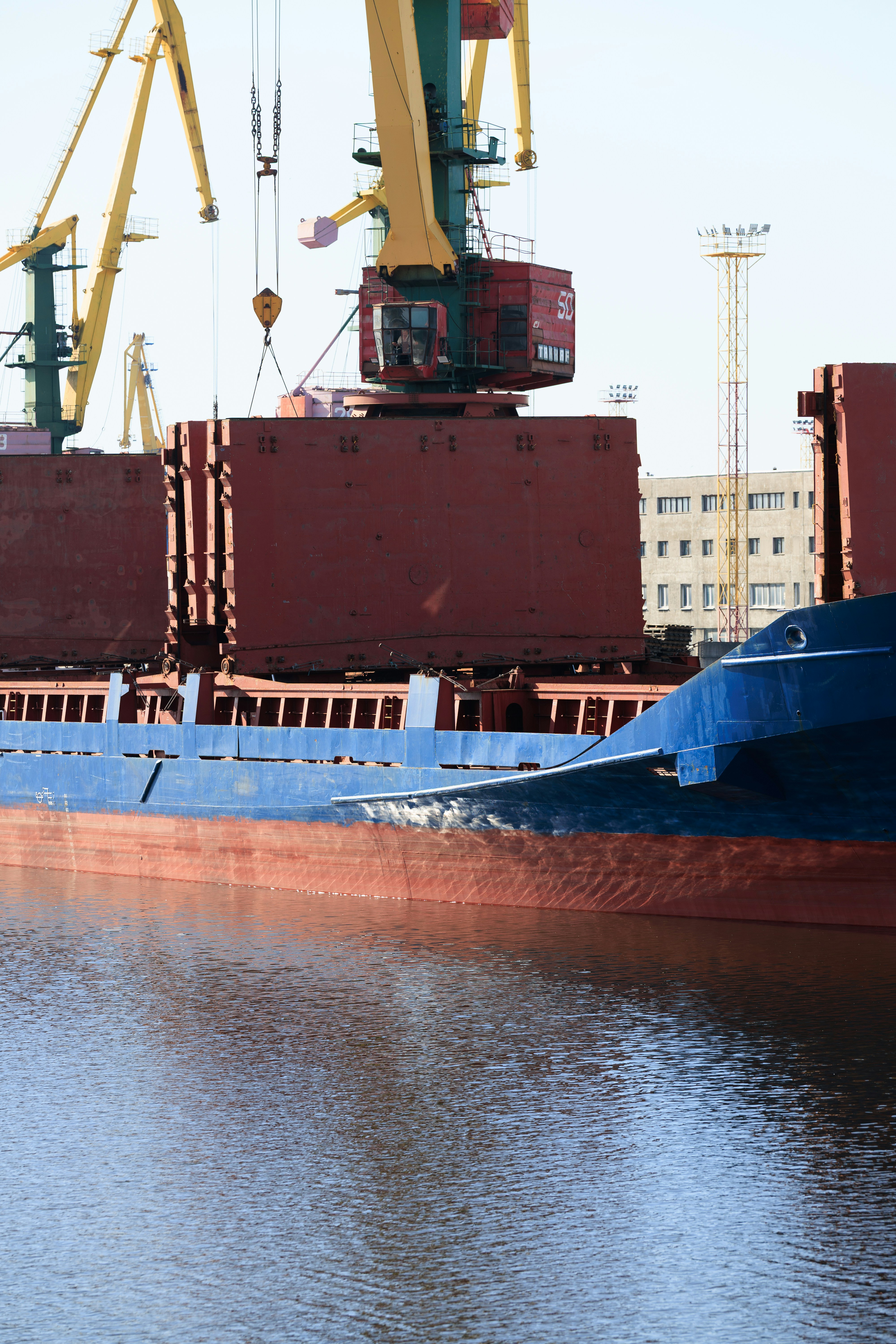 Crane Giants Over the Quiet Hull