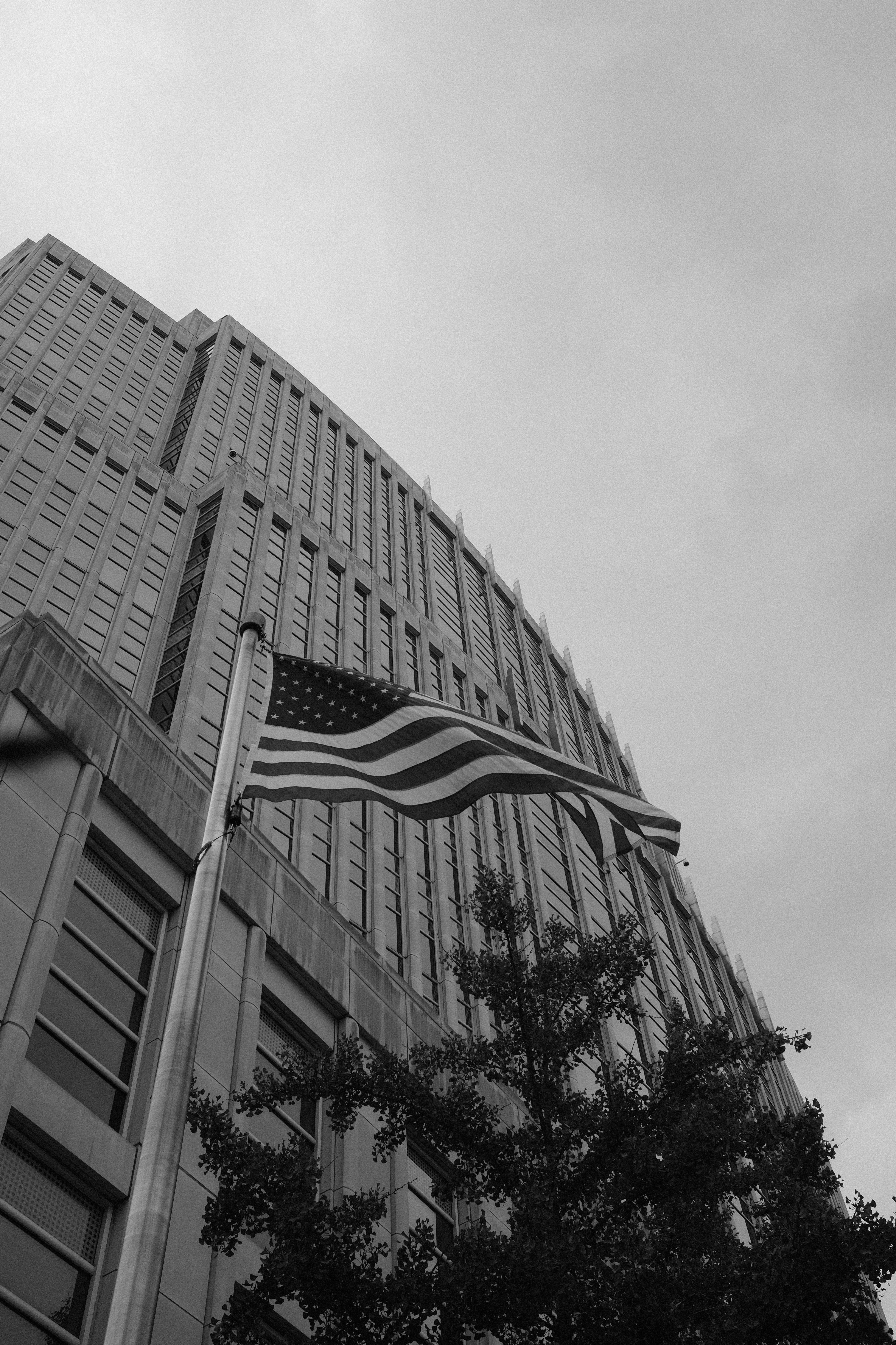 Flag Over Steel: A Monochrome City Facade and the American Banner