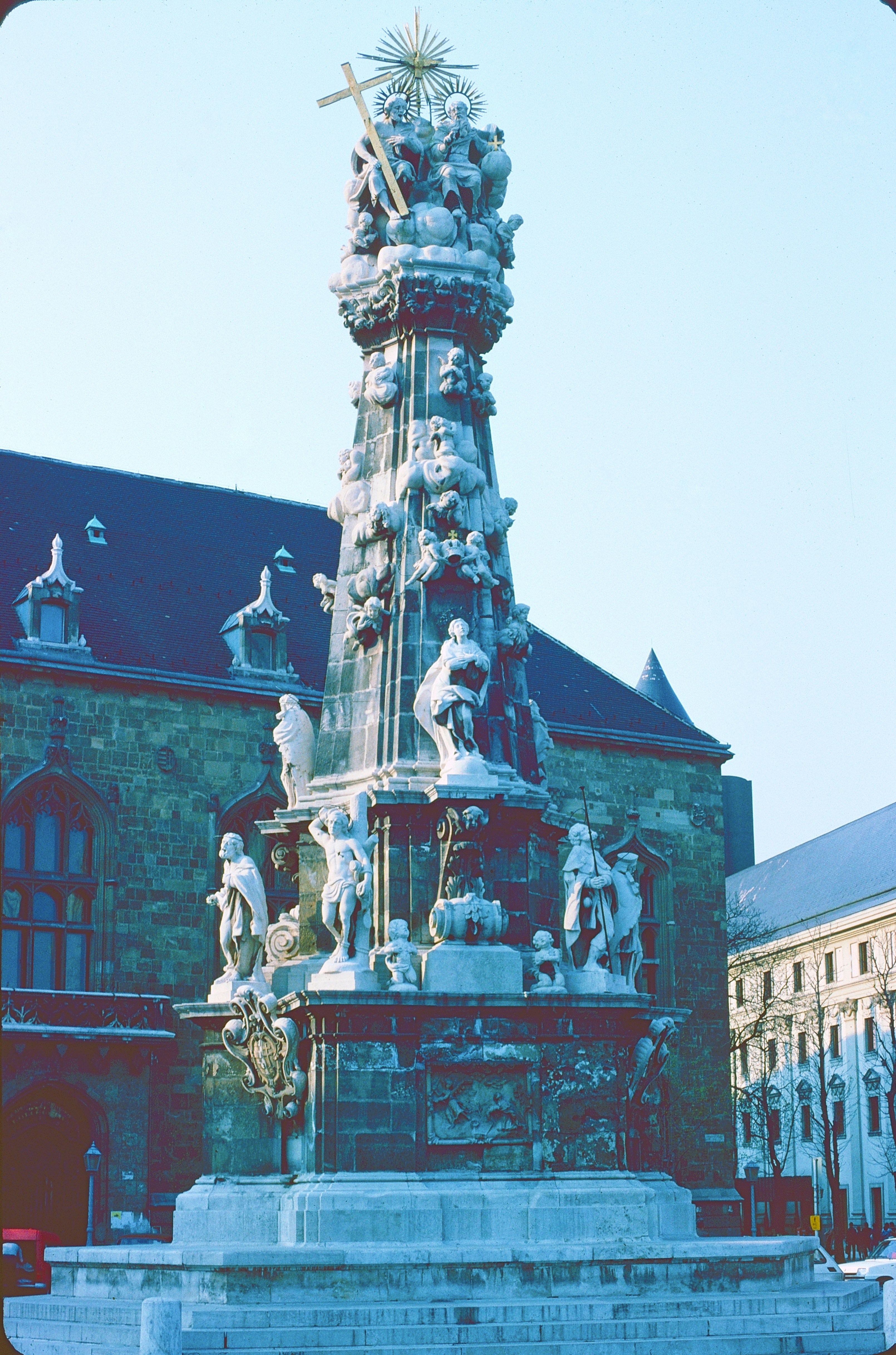Stone Spire of Statues Reaching Toward a Bright Sky