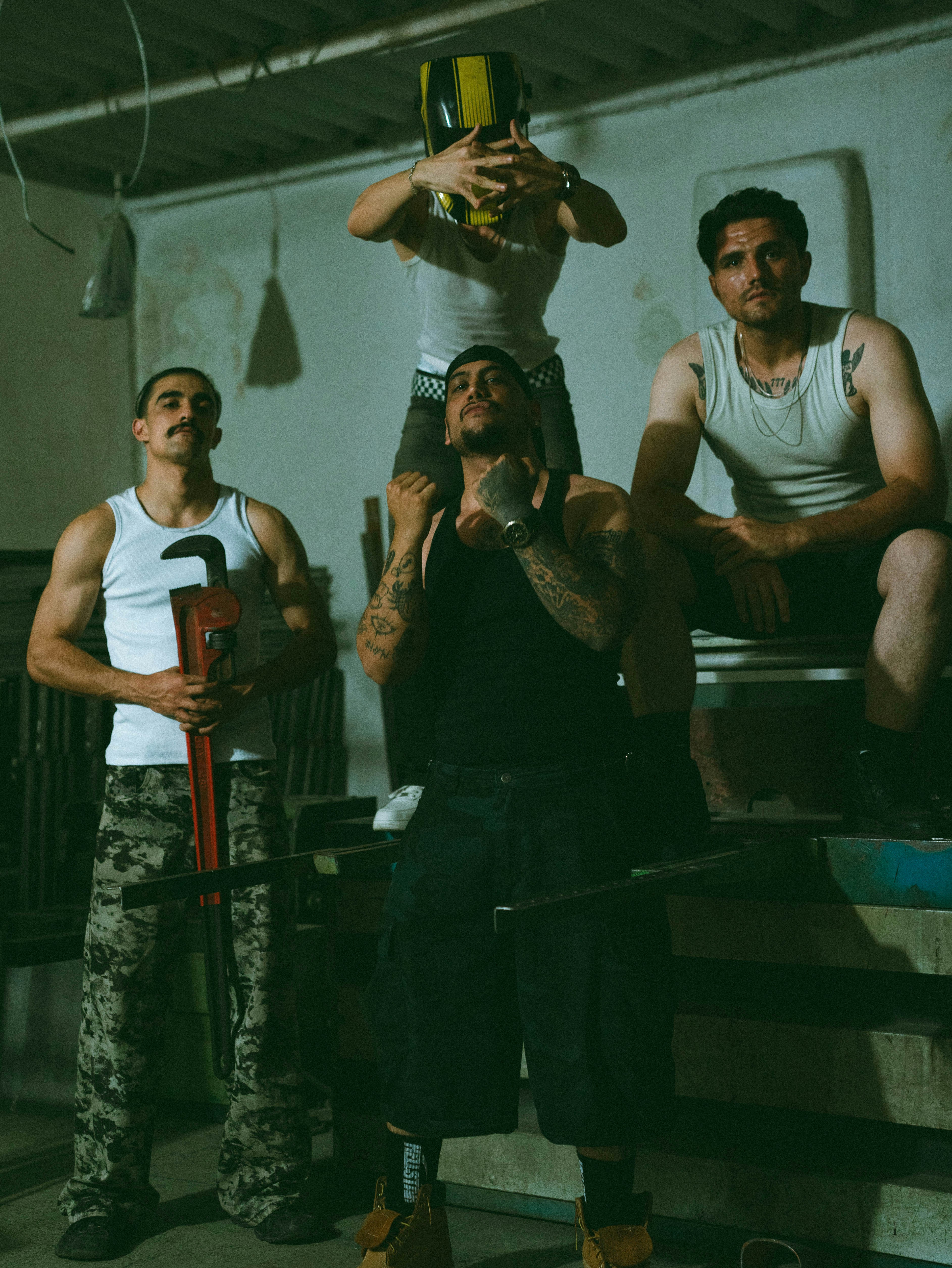 Underground Crew in Shadowy Workshop