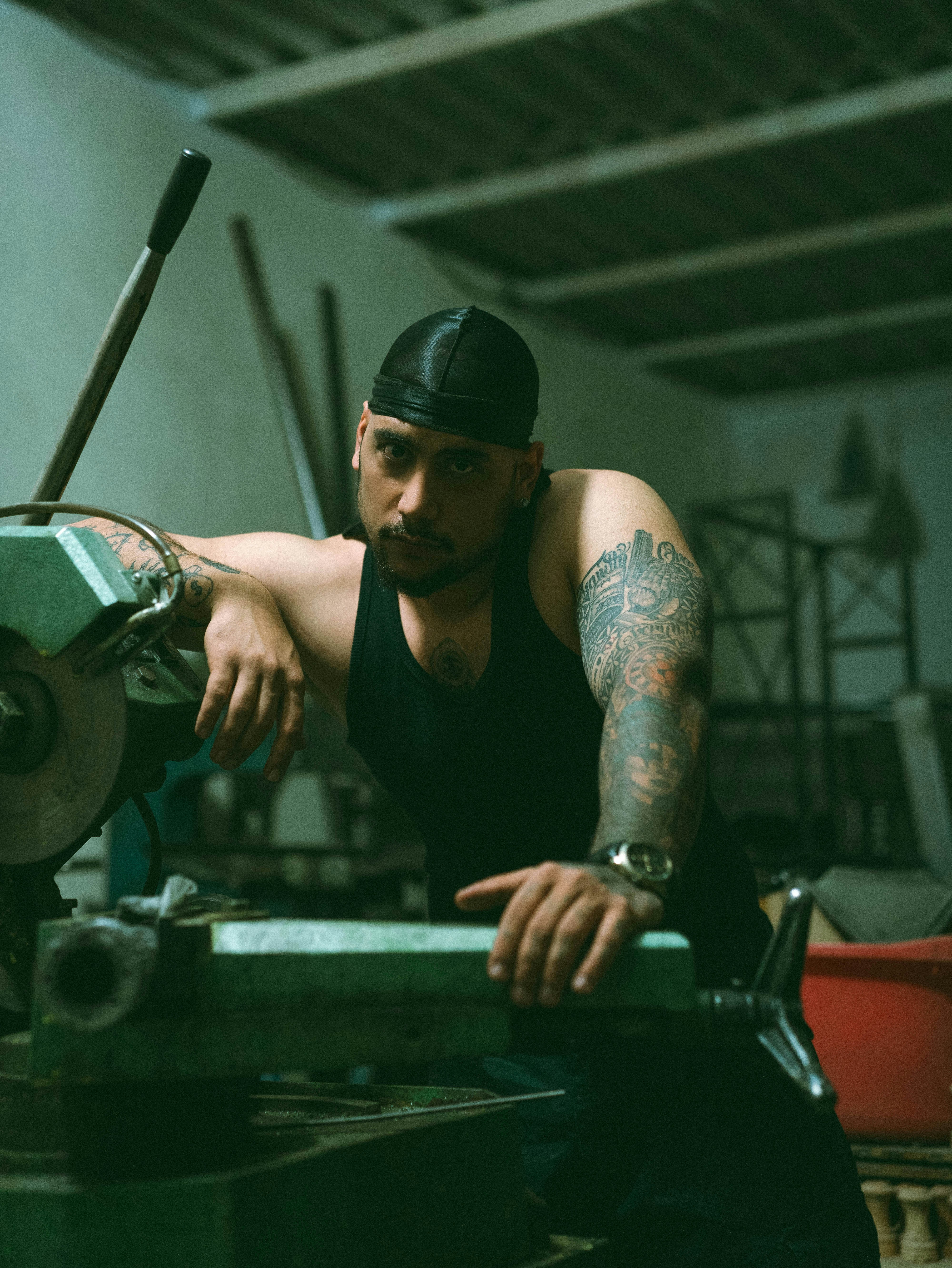 Industrial Grit: Portrait of Focus Under Heavy Lighting