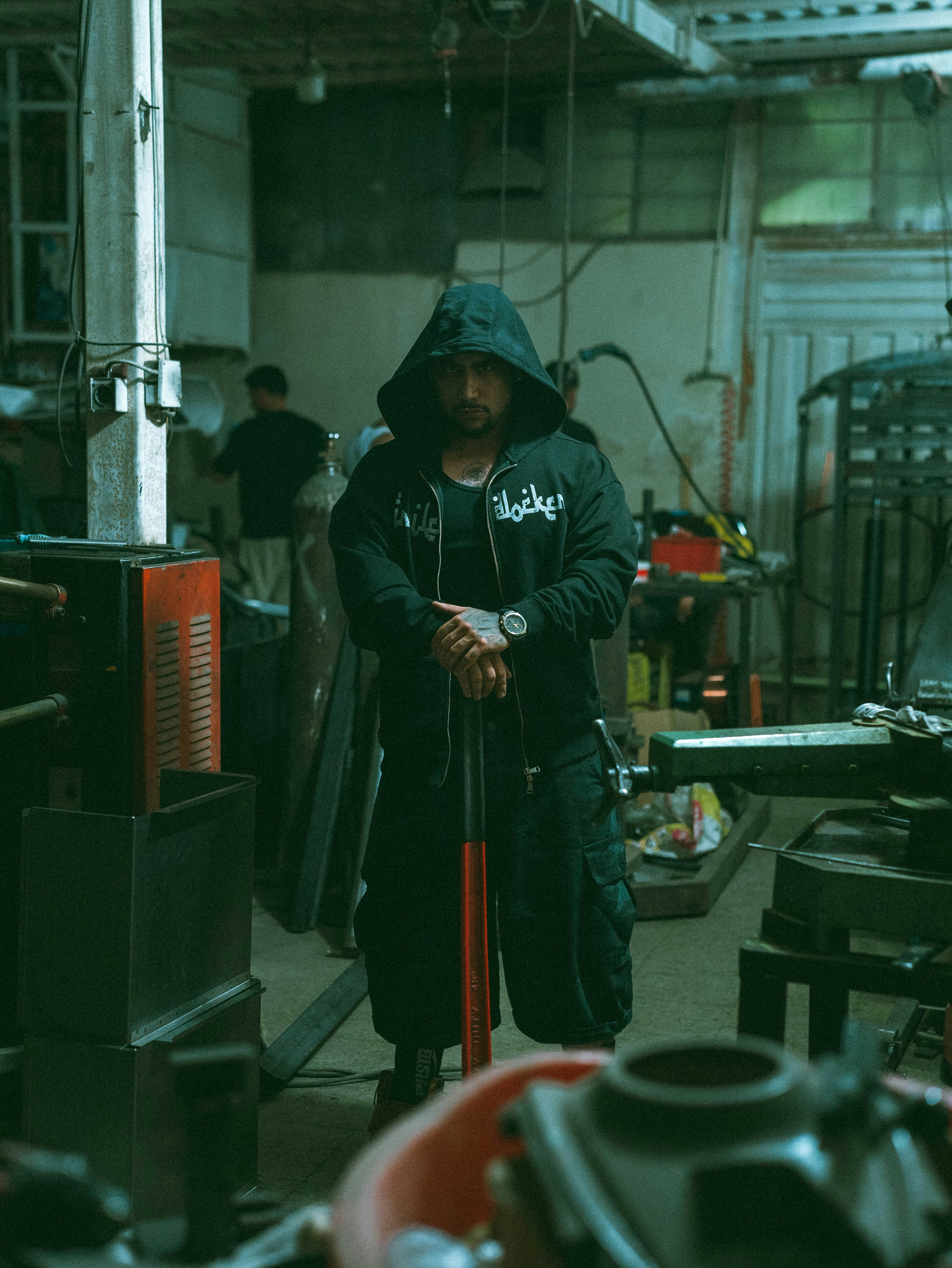 Midnight Mechanic: Focused Gaze in a Dim Workshop
