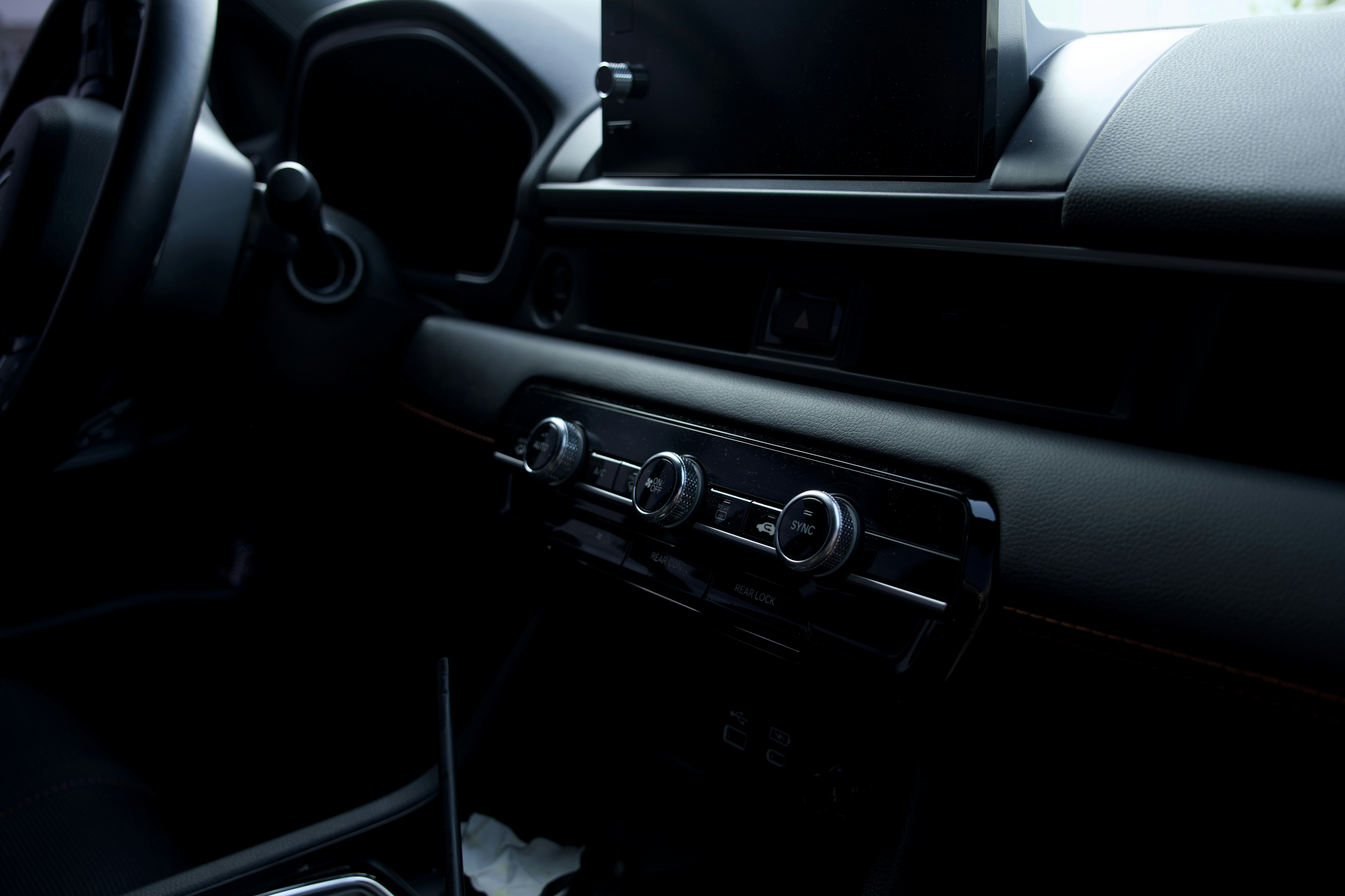 Low-light Car Cabin: A Quiet Focus on the Dashboard Dials
